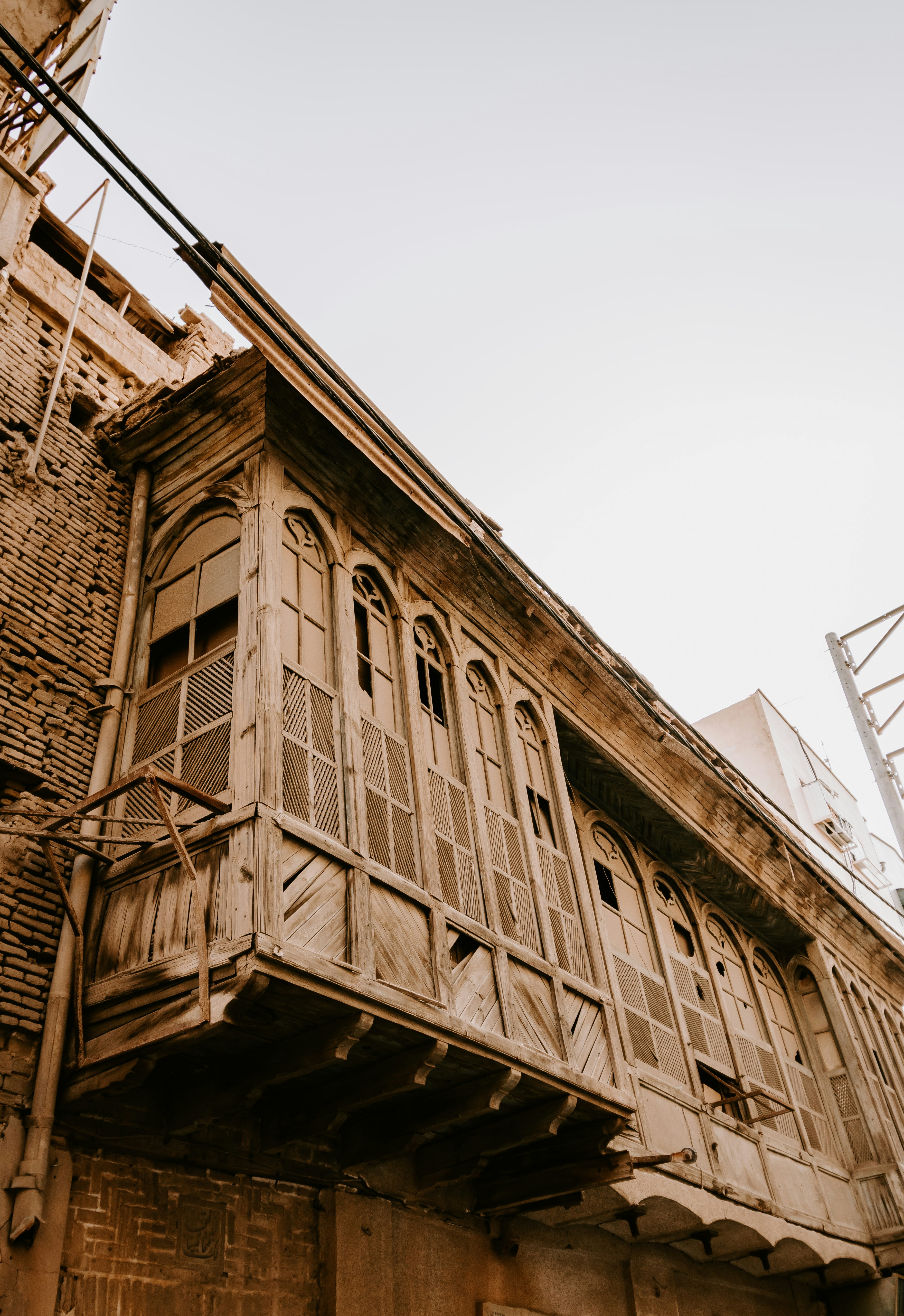 Tilted Timber Veranda Adorning a Weathered Facade