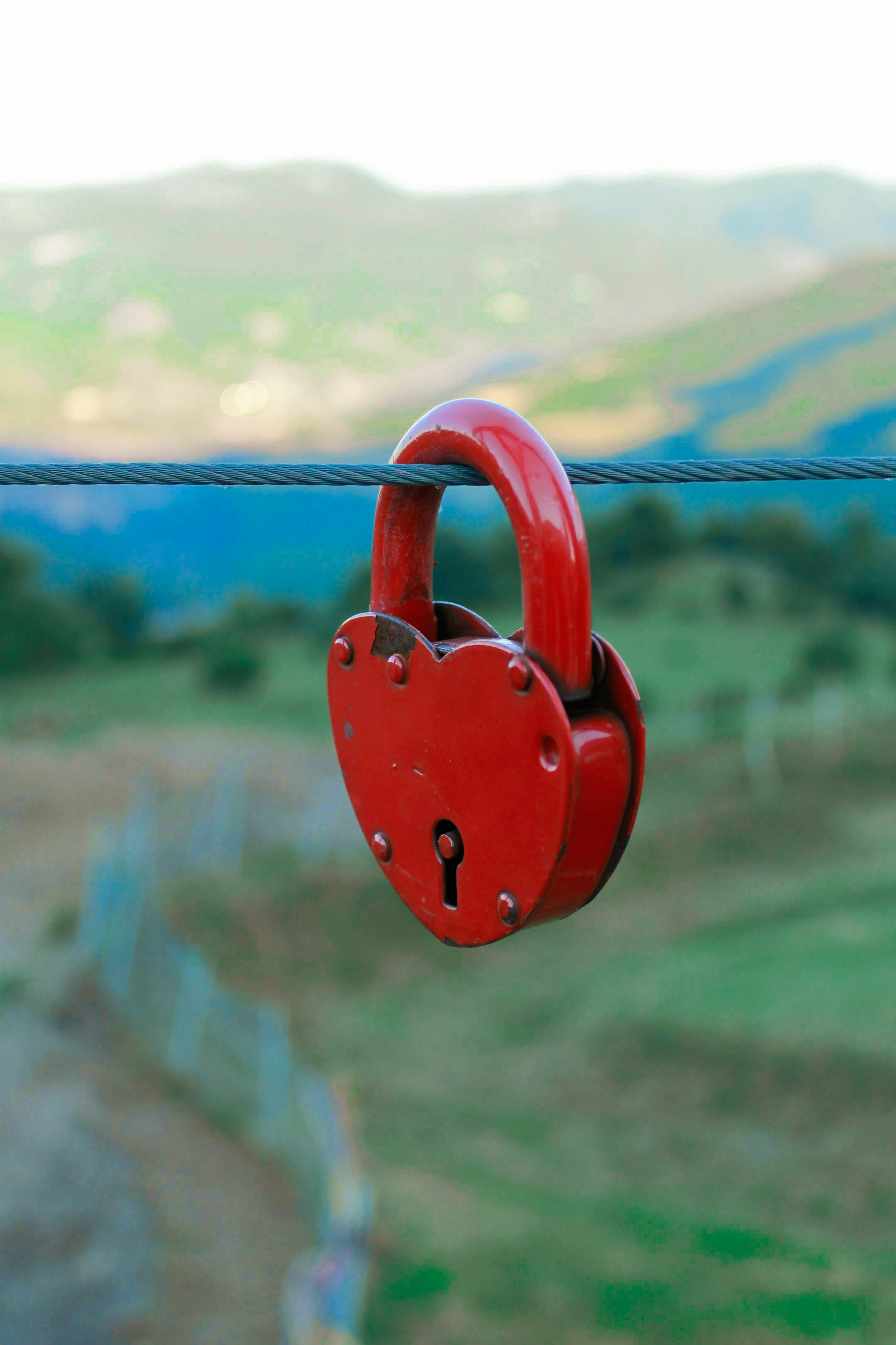 A red heart shaped padlock attached to a wire photo – Free Armenia ...