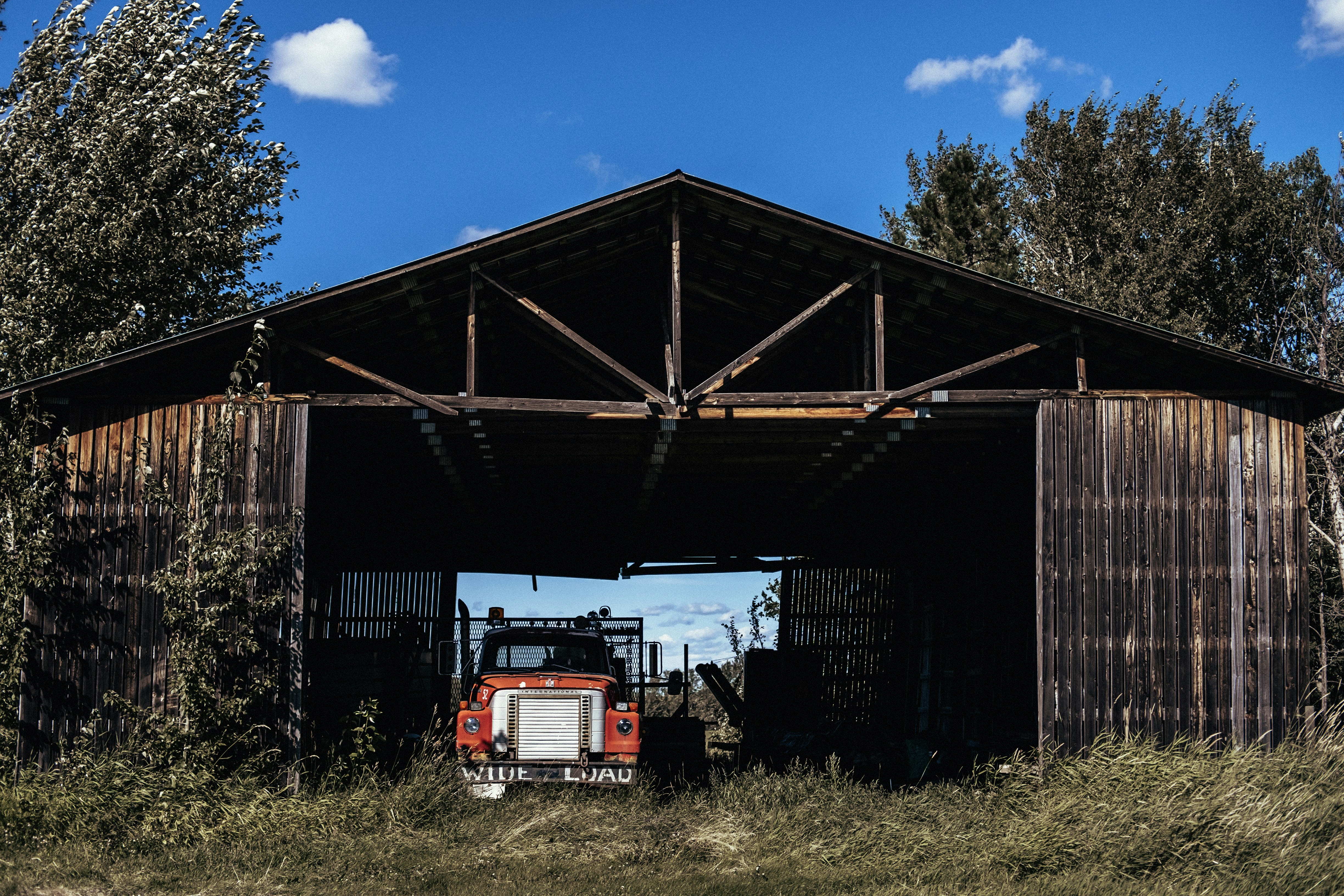 Crimson Hauler at the Barn’s Threshold