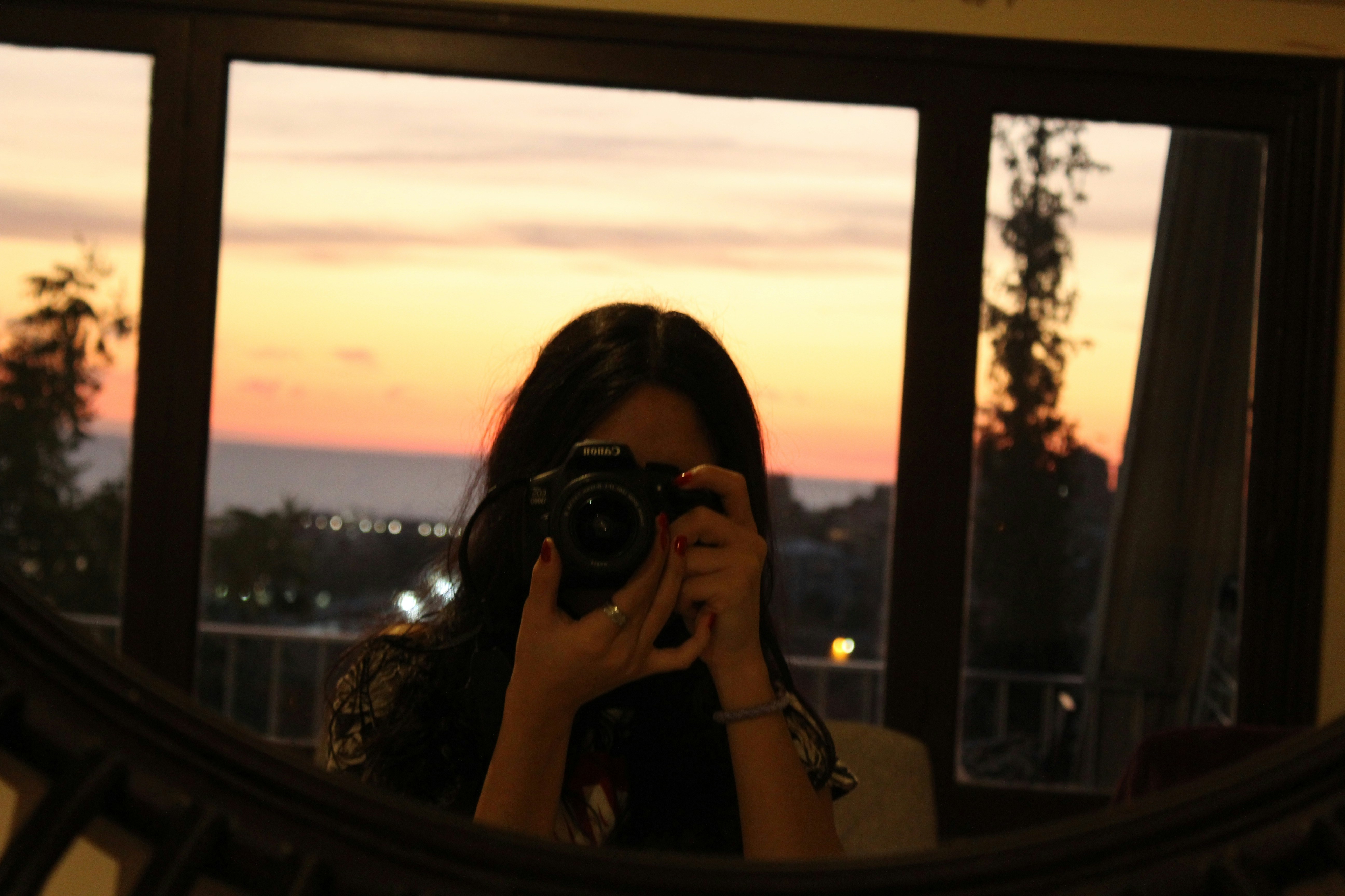 Woman taking photo of sunset photo – Free Girl Image on Unsplash