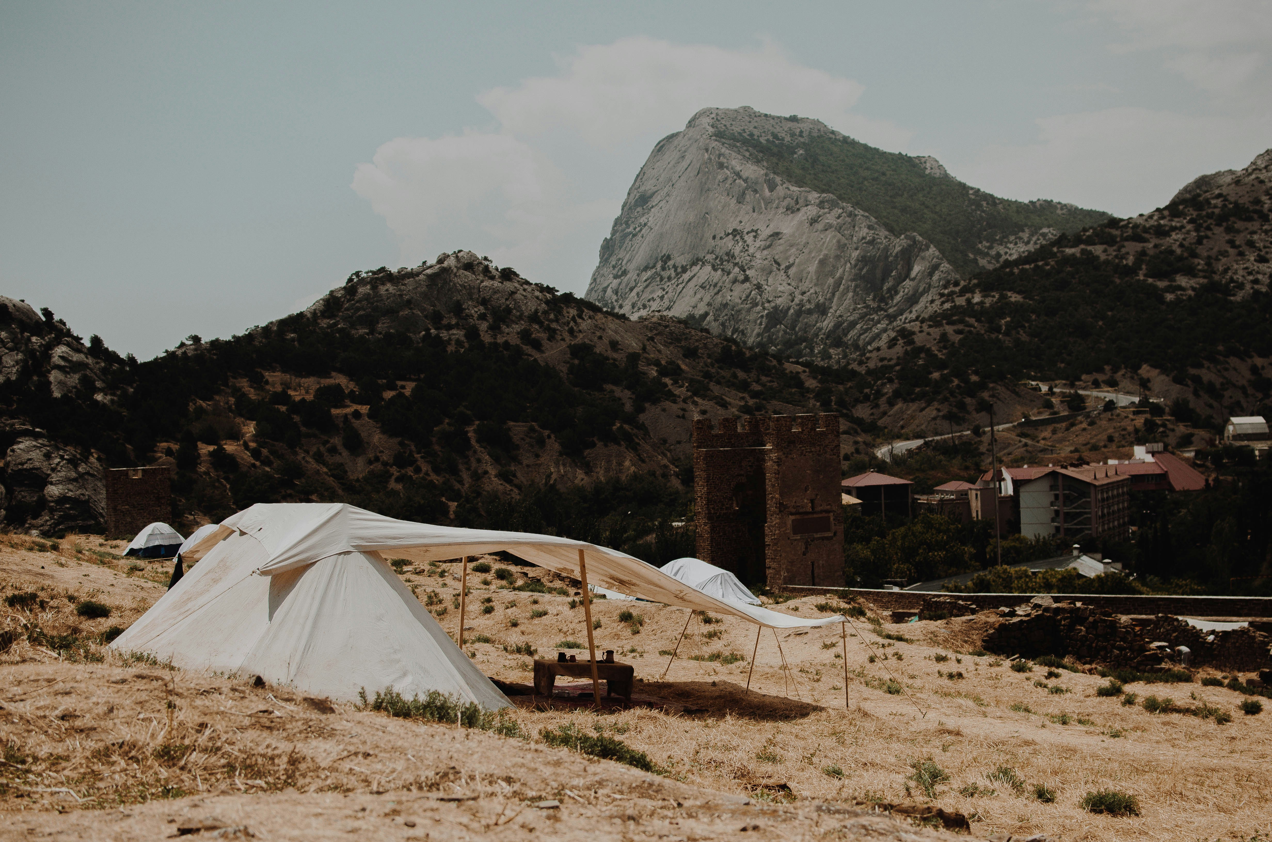 Desert Camp under a Jagged Peak