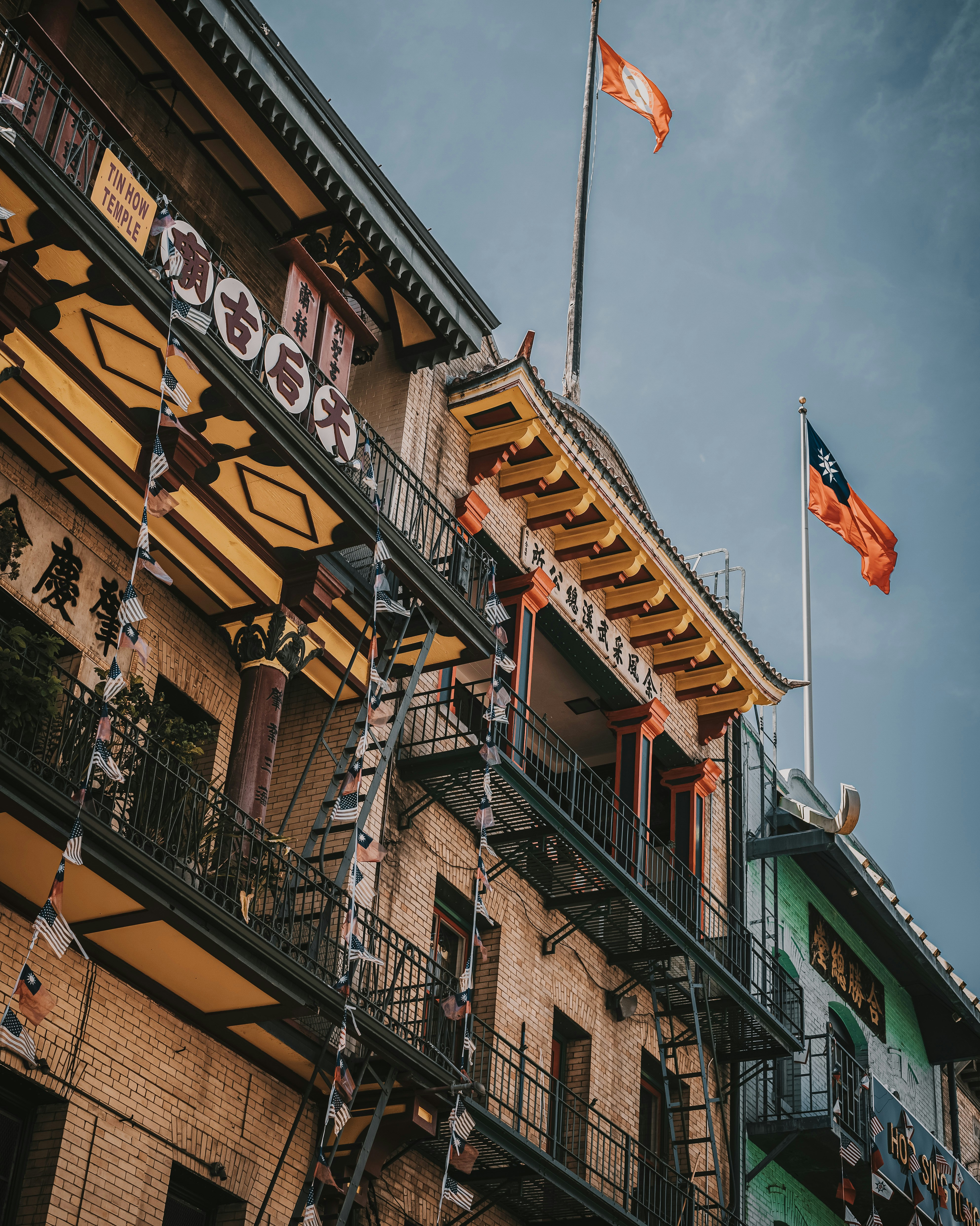 Neon Flags Over a Classic Chinatown Facade