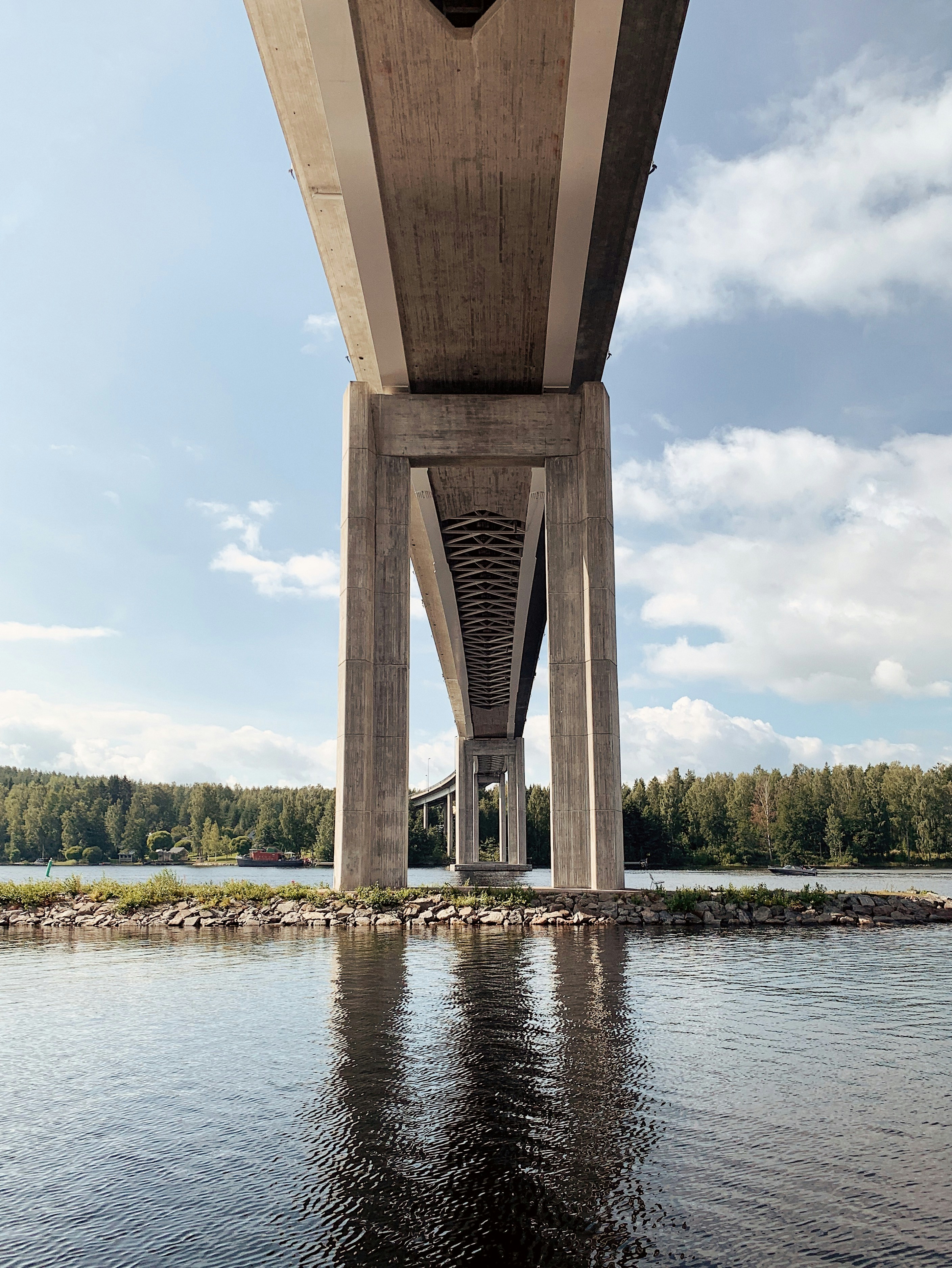Under the Monolithic Arches: A Concrete Bridge Corridor Reaching the Horizon