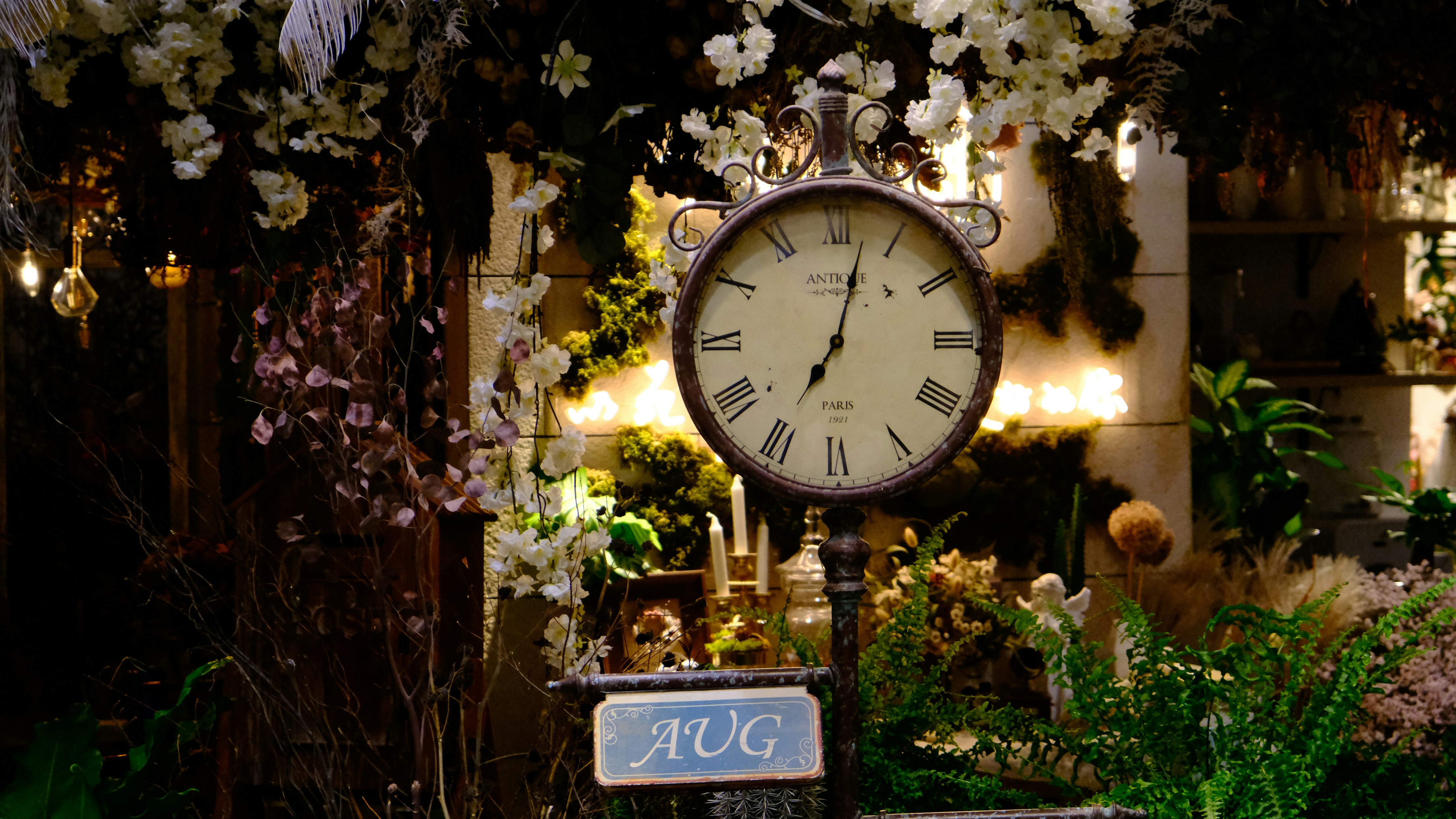 Clockwork Among Blooms: A Vintage Timepiece in a Floral Shop Display