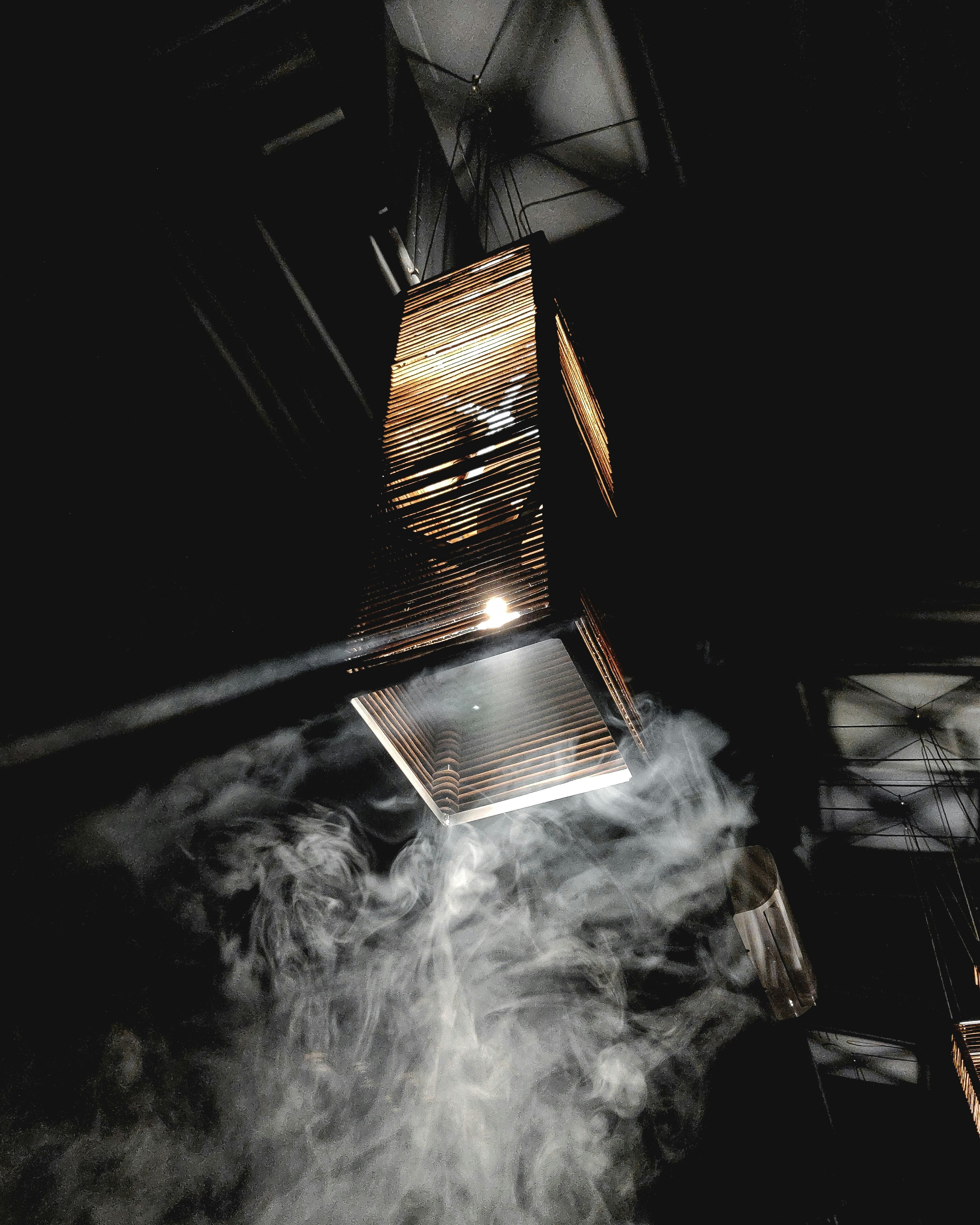 Hanging Lanterns in Dim Studio: A Study in Shadow and Smoke