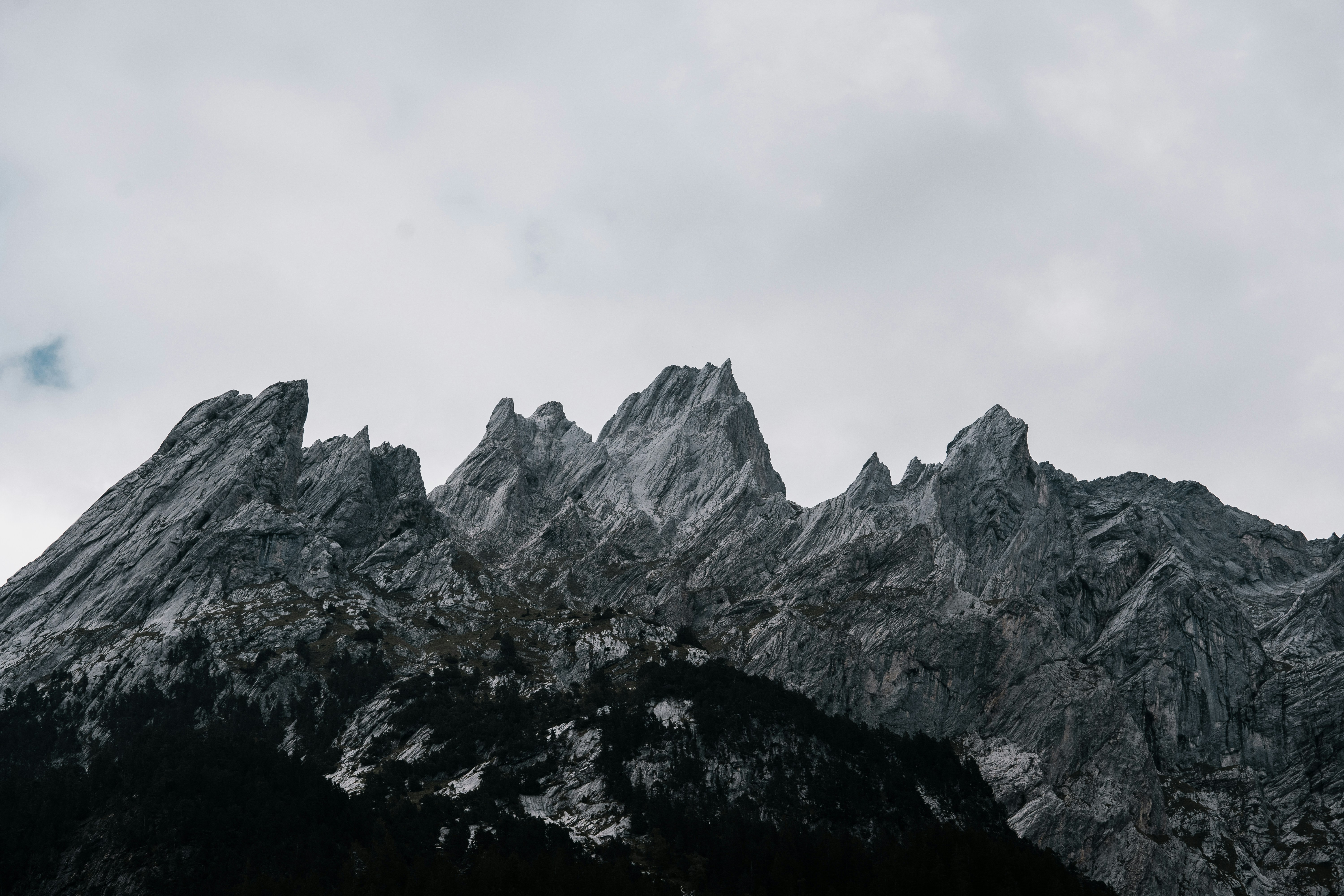 Gray rocky mountain under white cloudy sky during daytime photo – Free ...