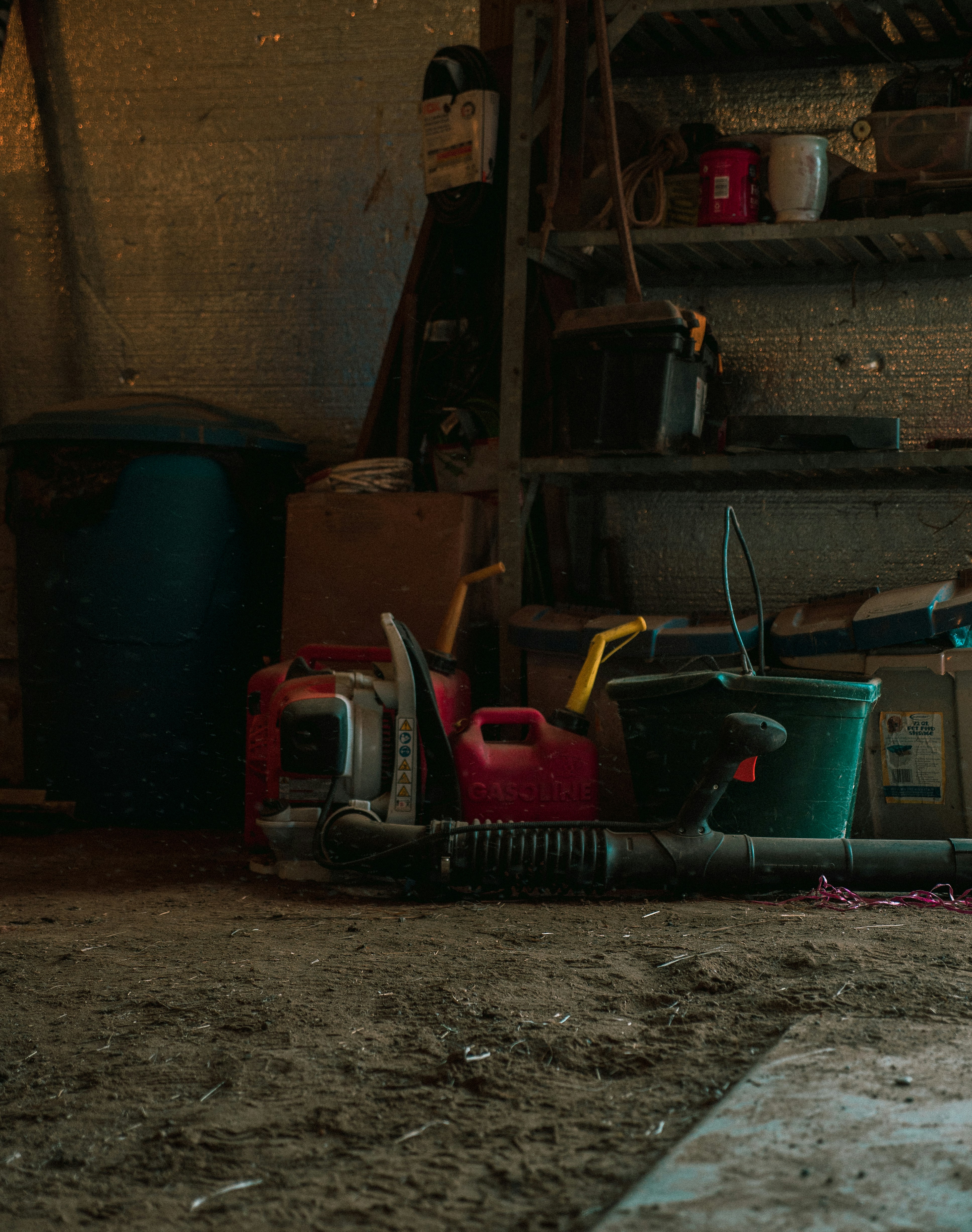 Red and black power tool beside blue plastic container photo – Free ...