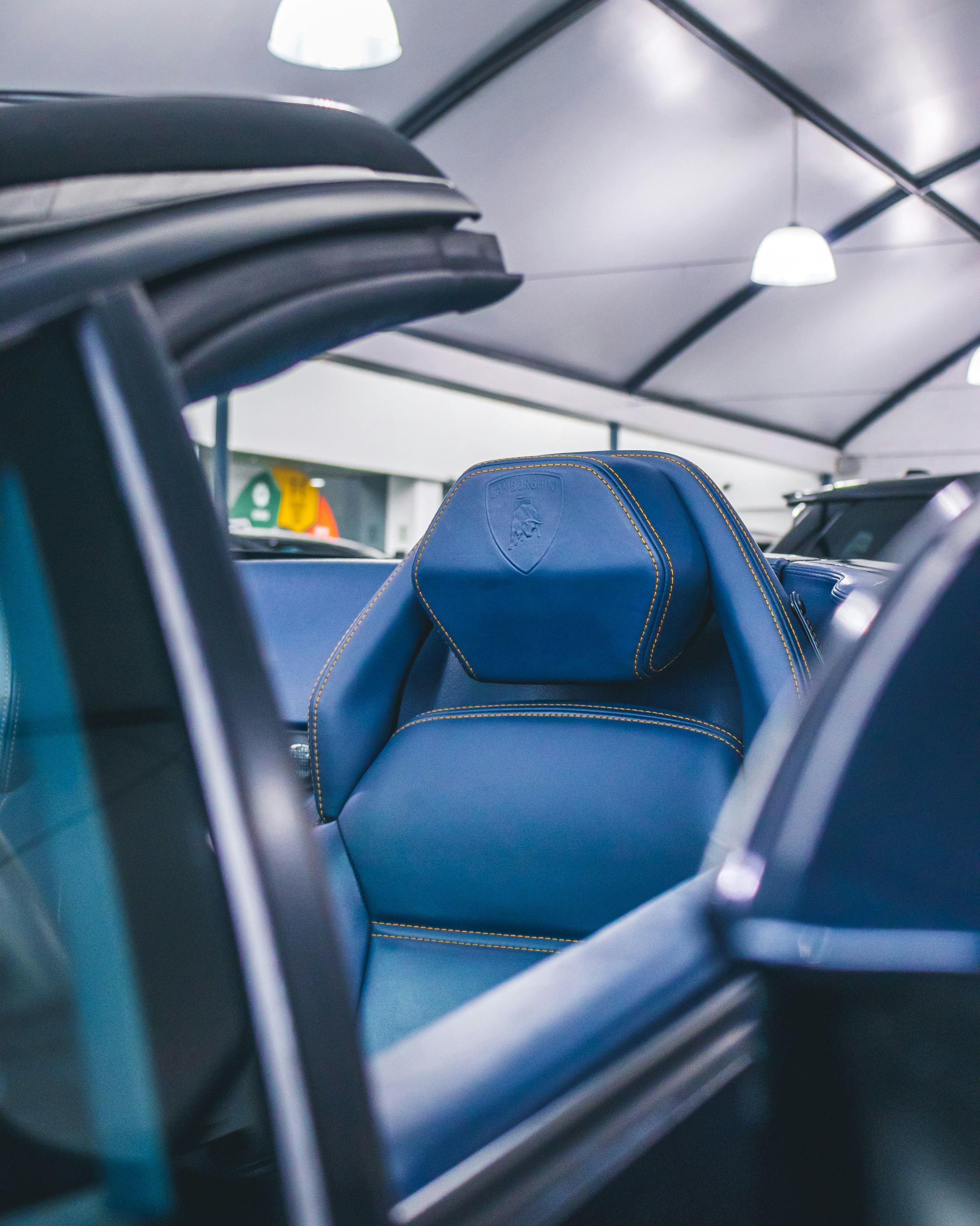 Cobalt Cockpit: Hand-stitched Blue Leather in a Quiet Showroom
