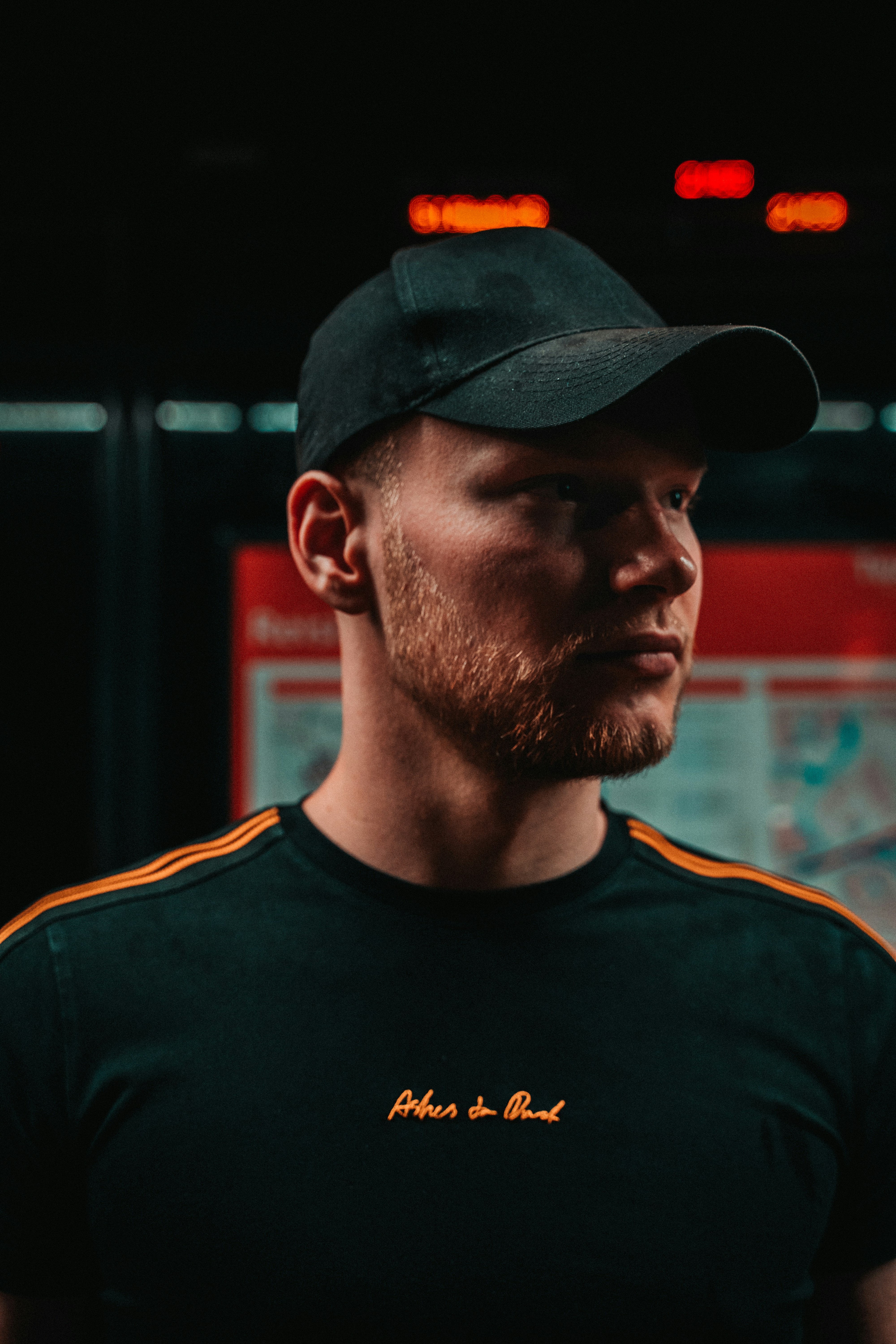 Night Shift Portrait: Cap, Beard, and Subway Glow