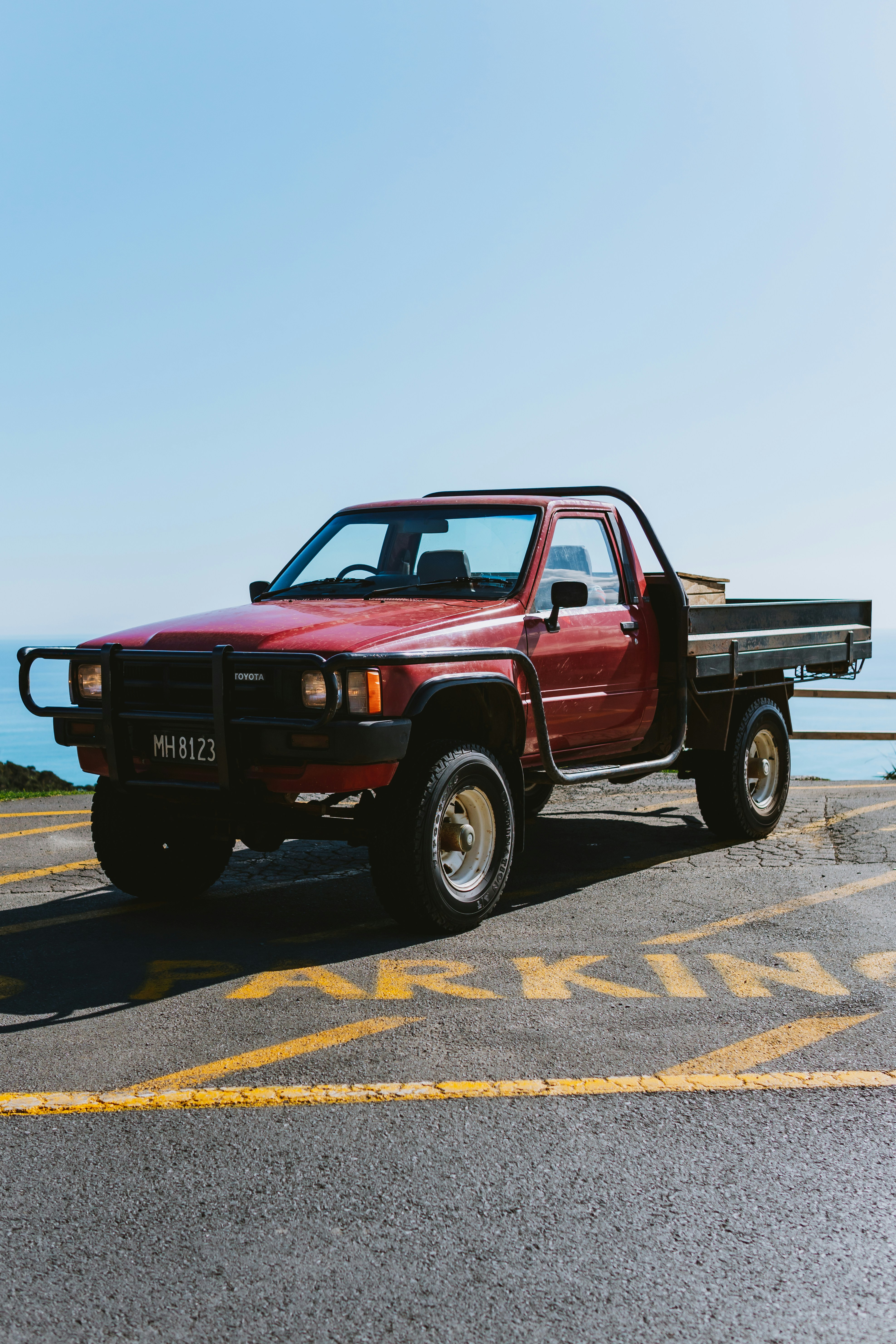Coastal Red Workhorse: A Toyota Pickup By the Sea