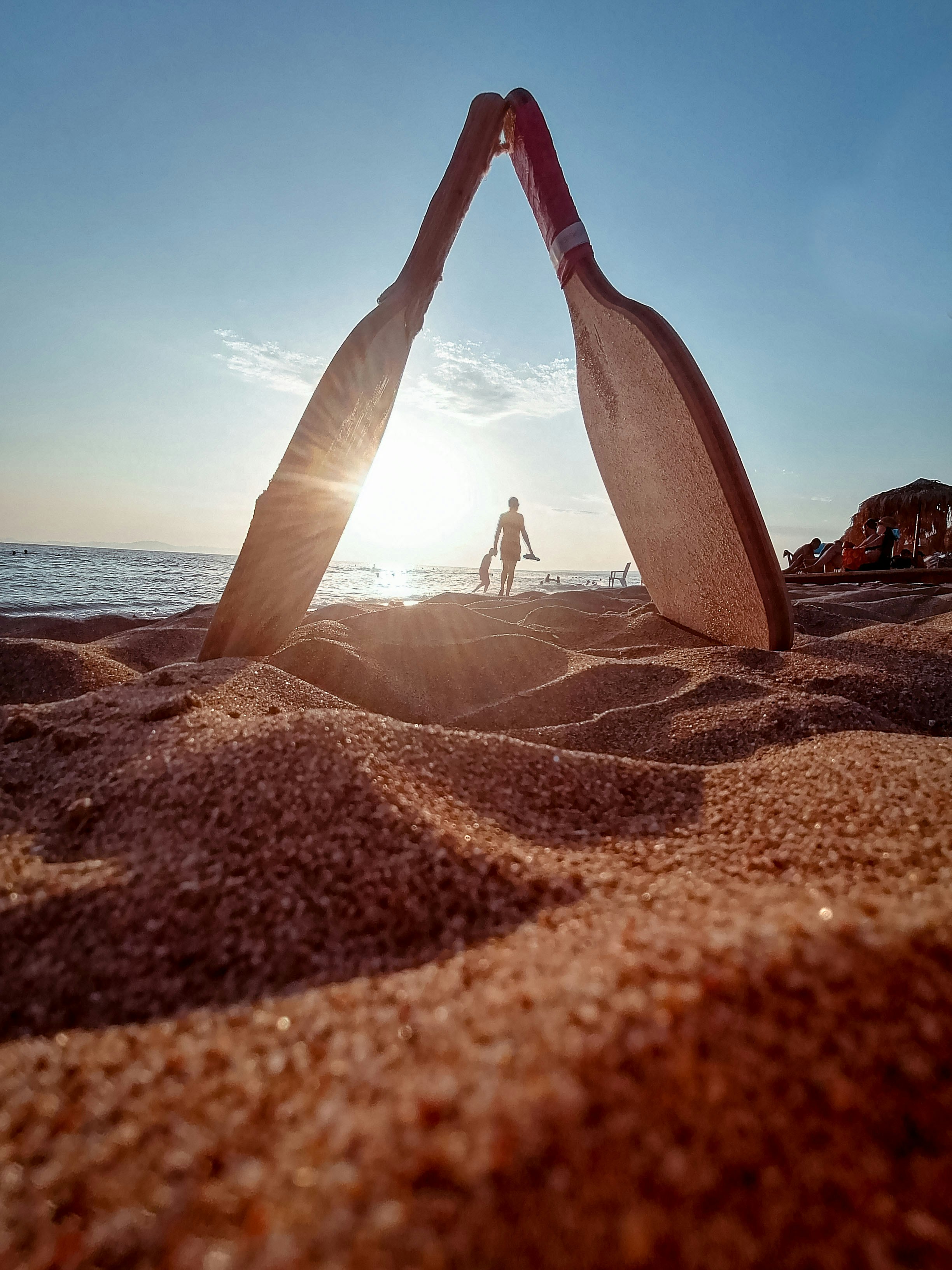 woman in pink bikini on brown sand beach during daytime
