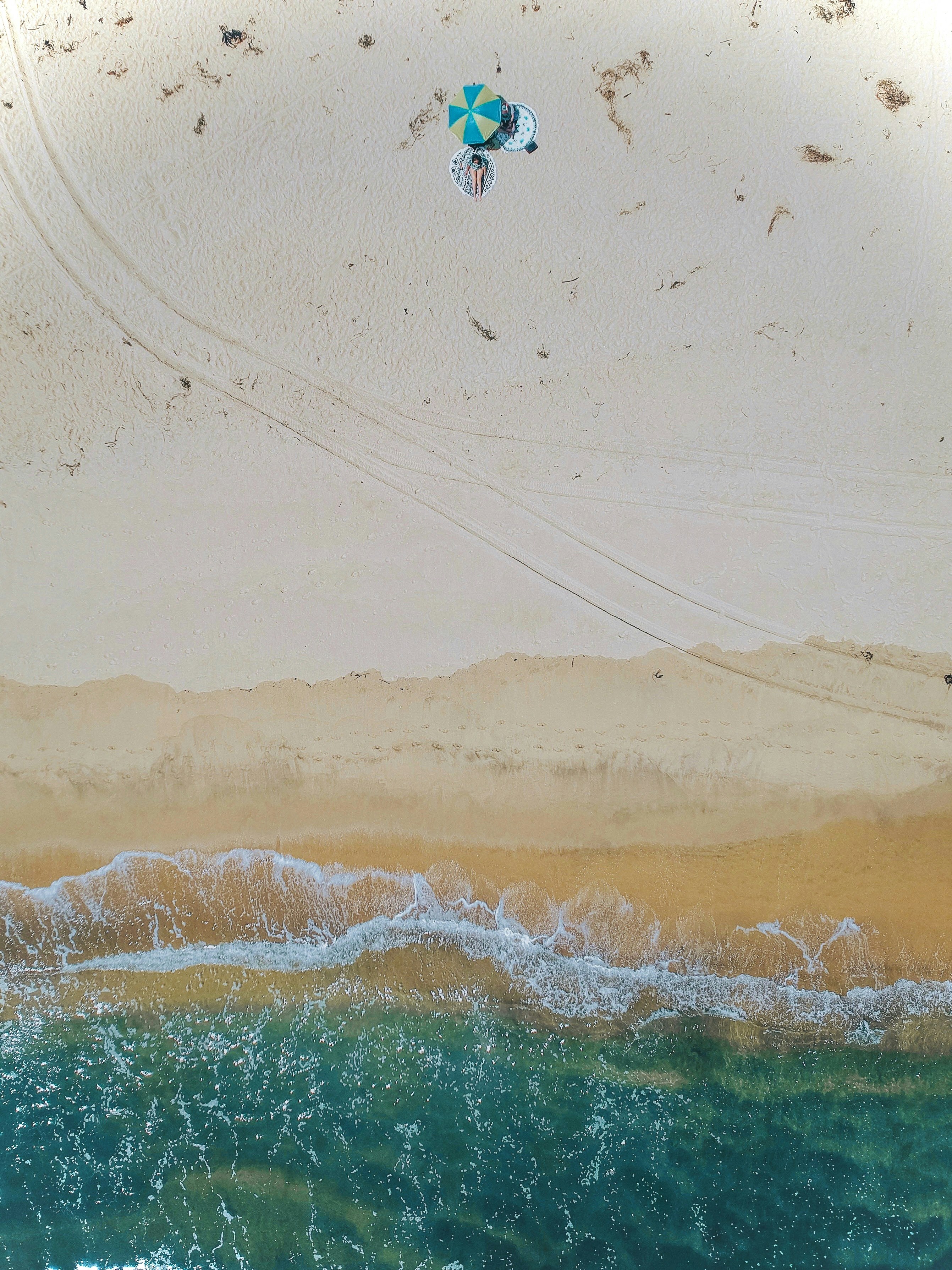 person surfing on sea waves during daytime