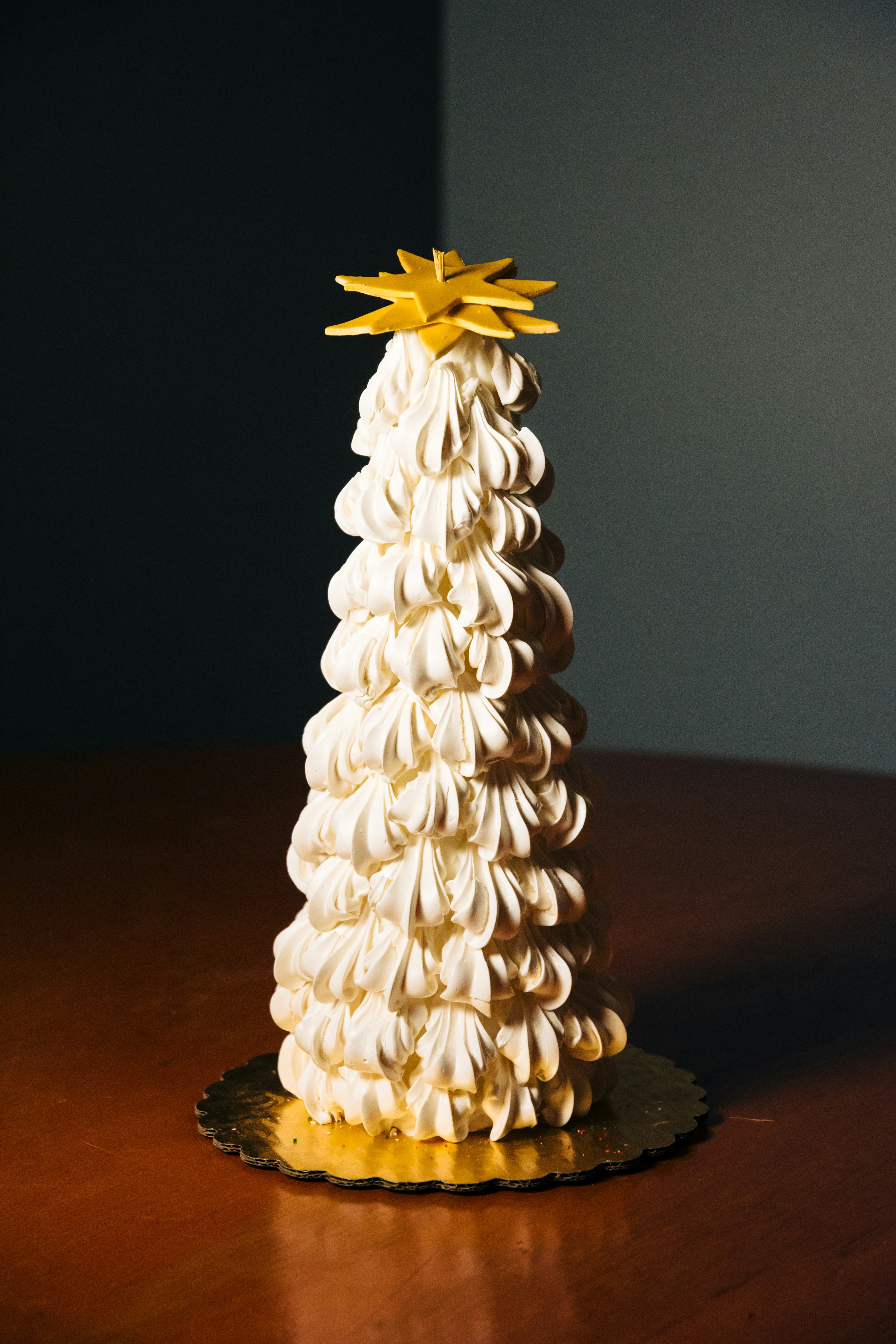 Whimsical Summit: A Cream-Topped Tower Stands Proud
