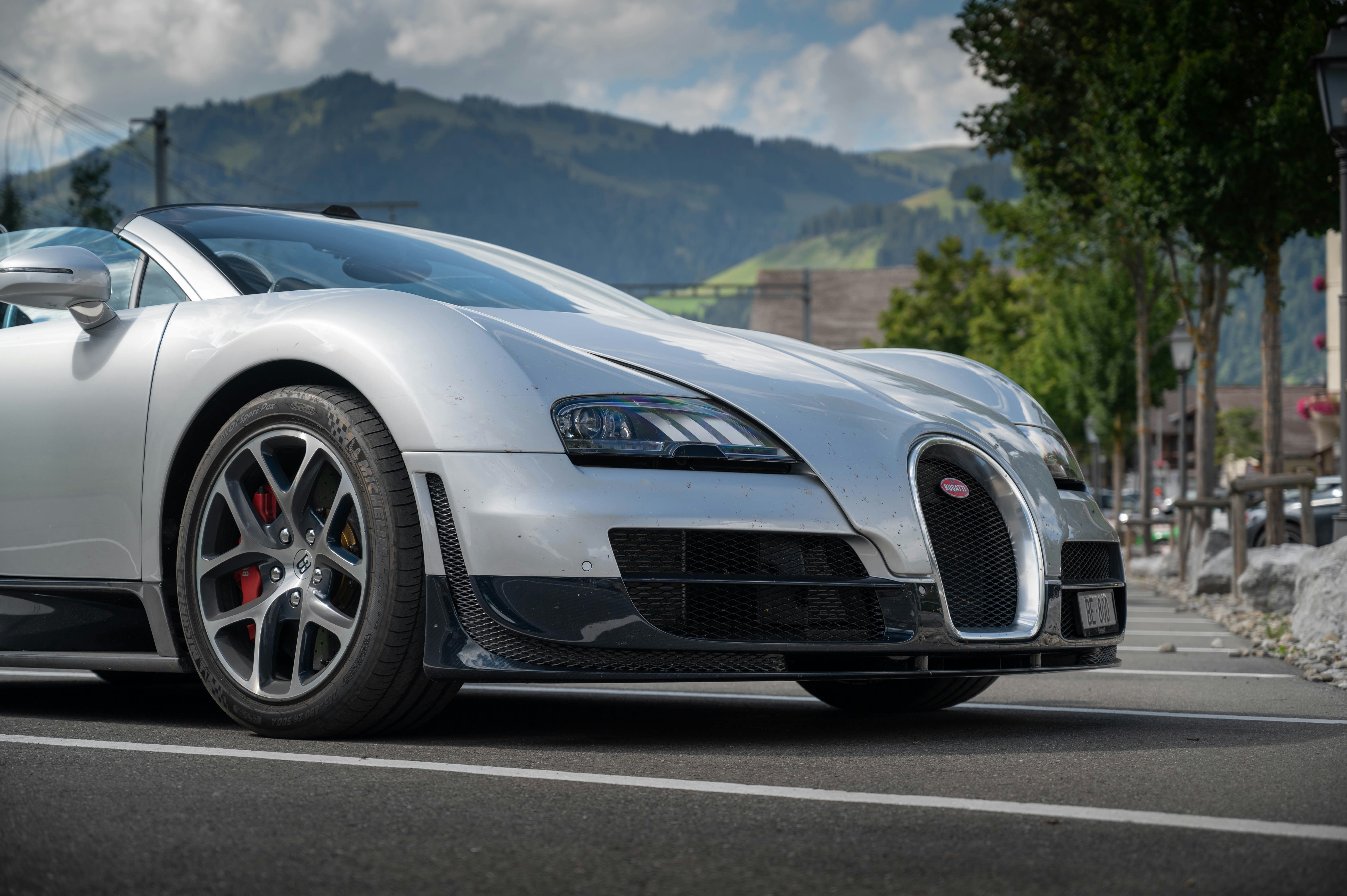 A white bugatti is parked on the street photo – Free Switzerland Image ...