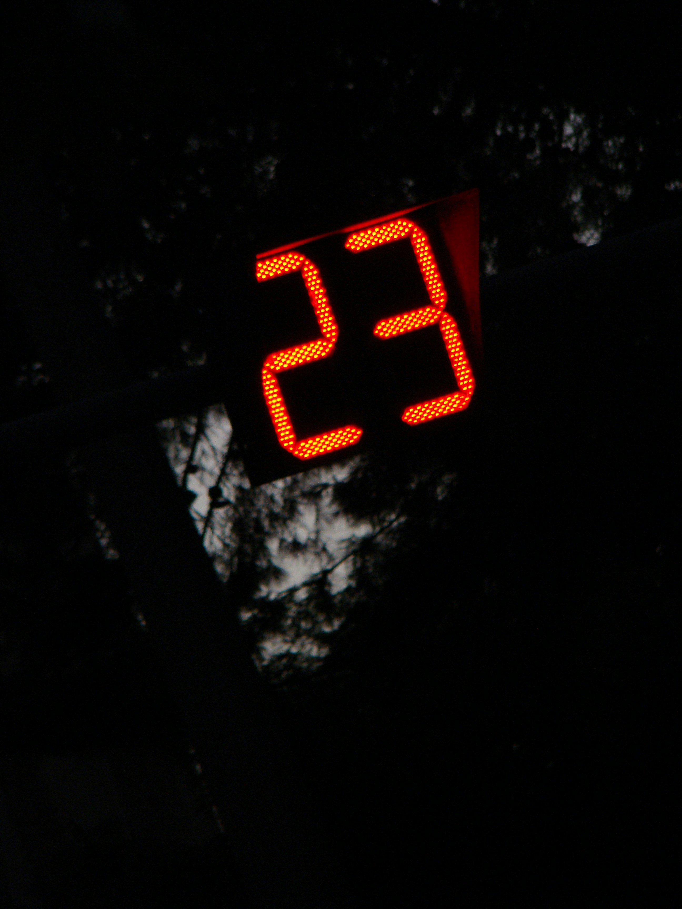 Digital display showing the number '23' in bright red against a dark backdrop, conveying urgency and anticipation.