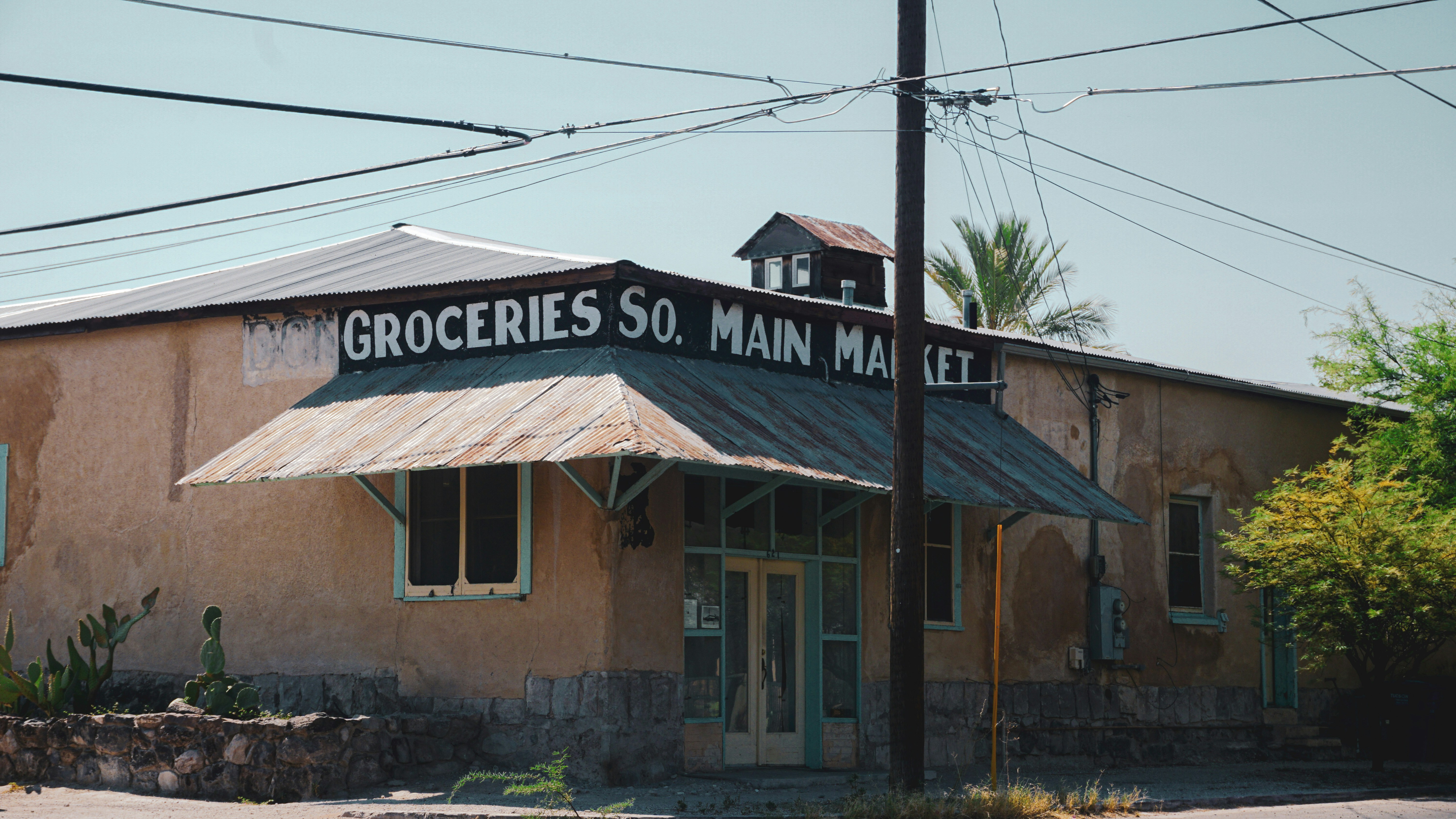 Sun-bleached General Store Under a Weathered Canopy