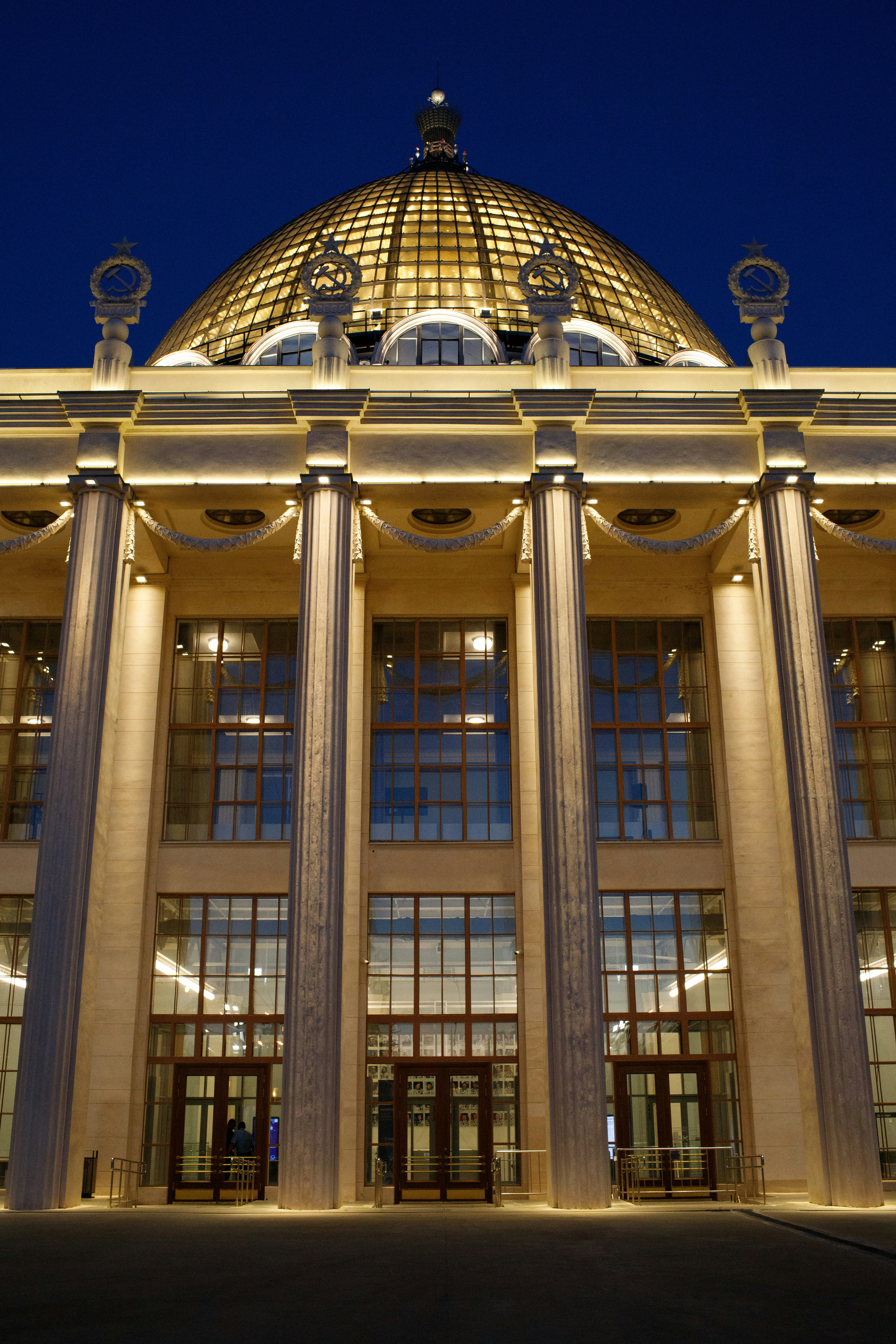Dome of Warm Light Over a Marble Colonnade at Night