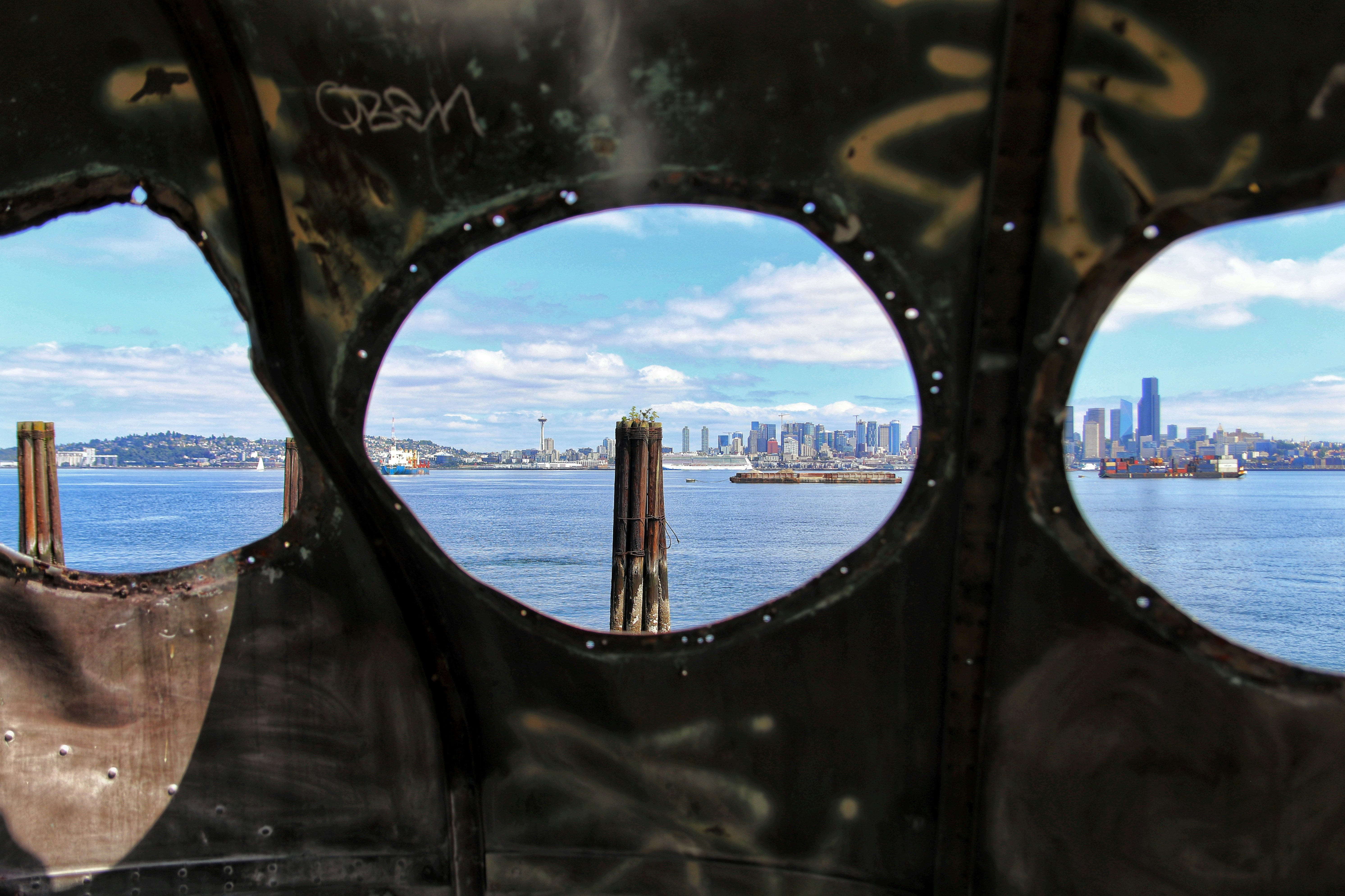 Urban Skyline Framed by Circular Portholes