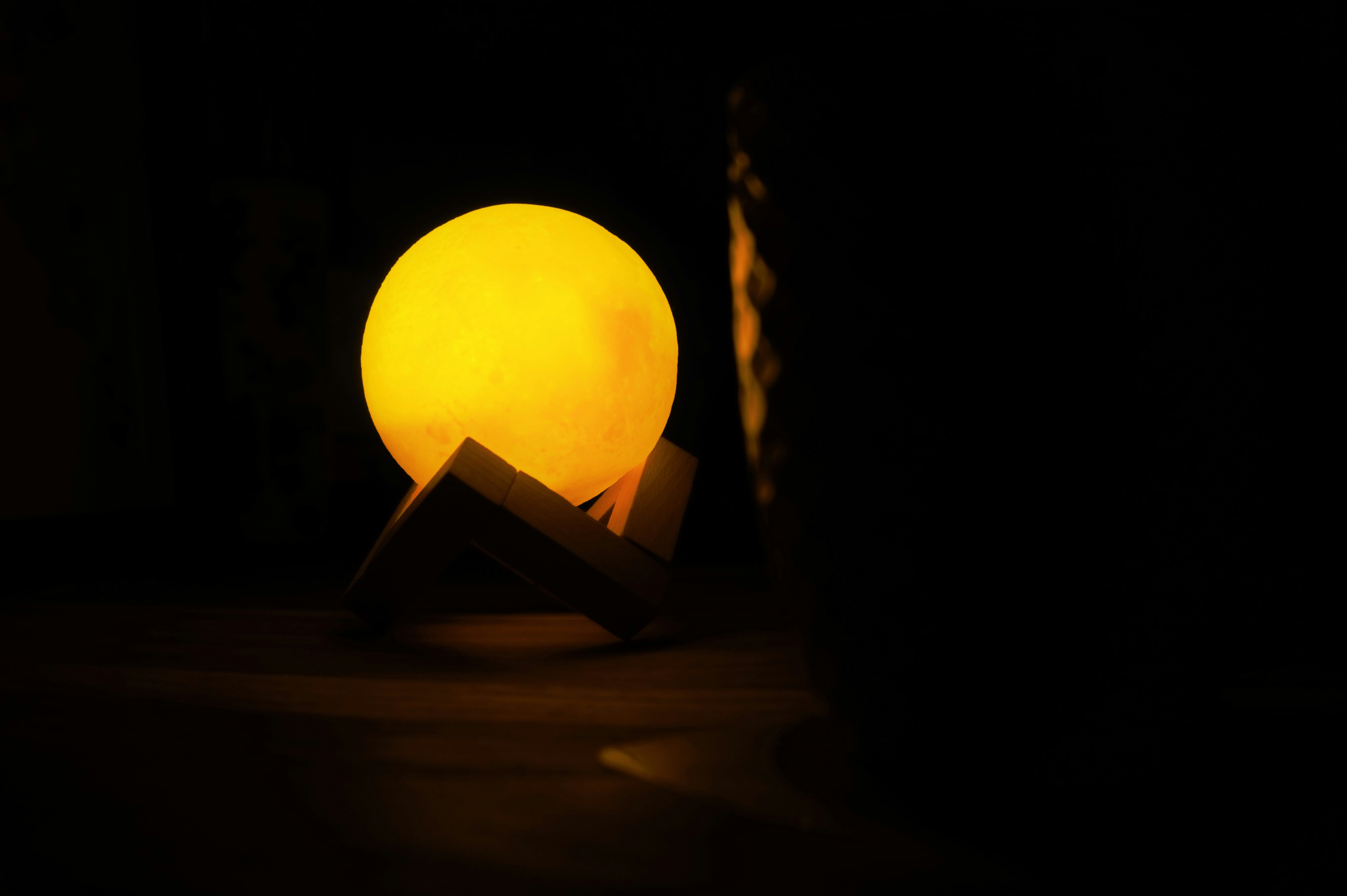 Glowing orb on a quiet stage: a warm minimalist still life