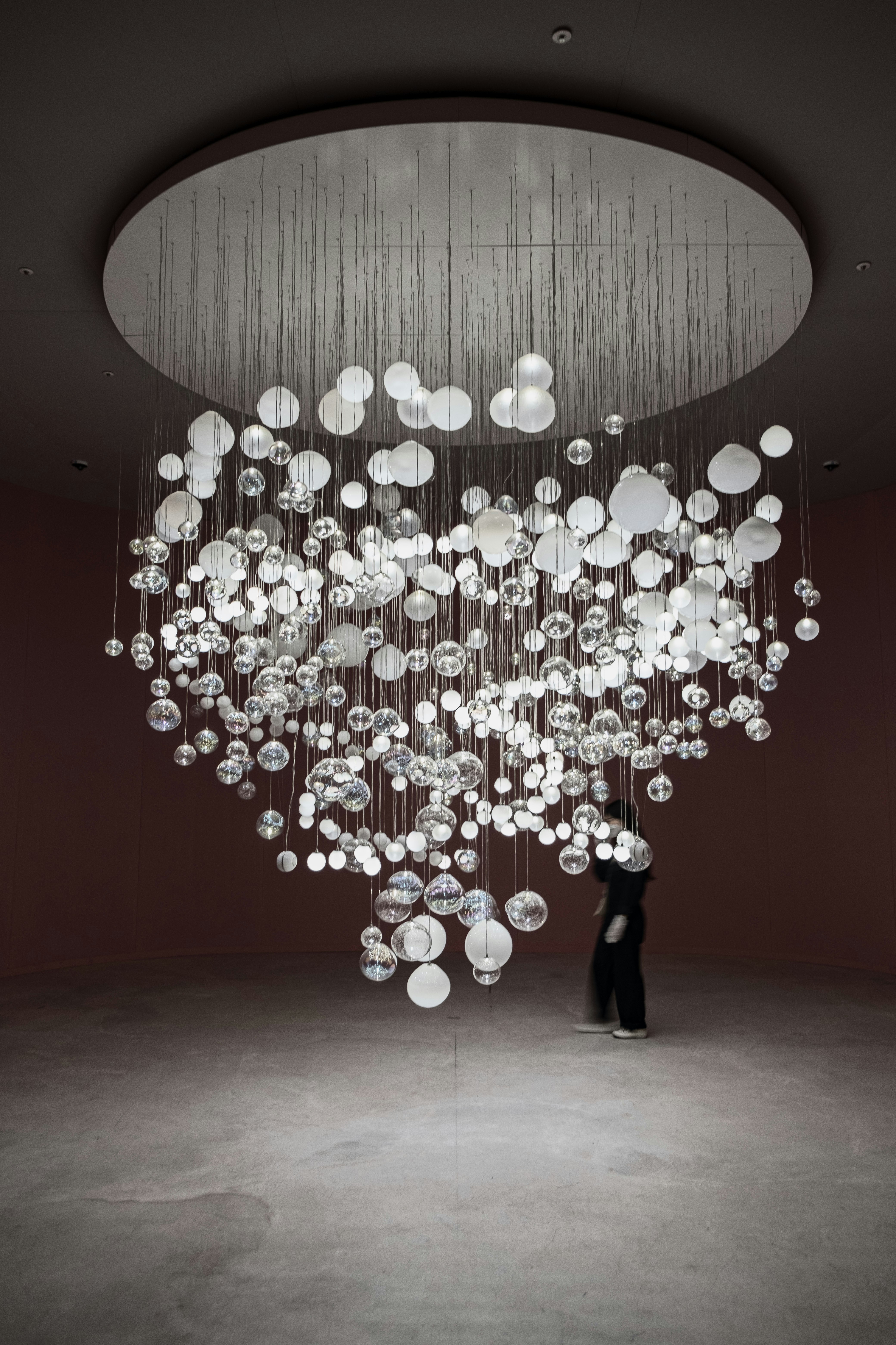 Floating Orbs: A Dreamscape of Light in a Gallery Halo