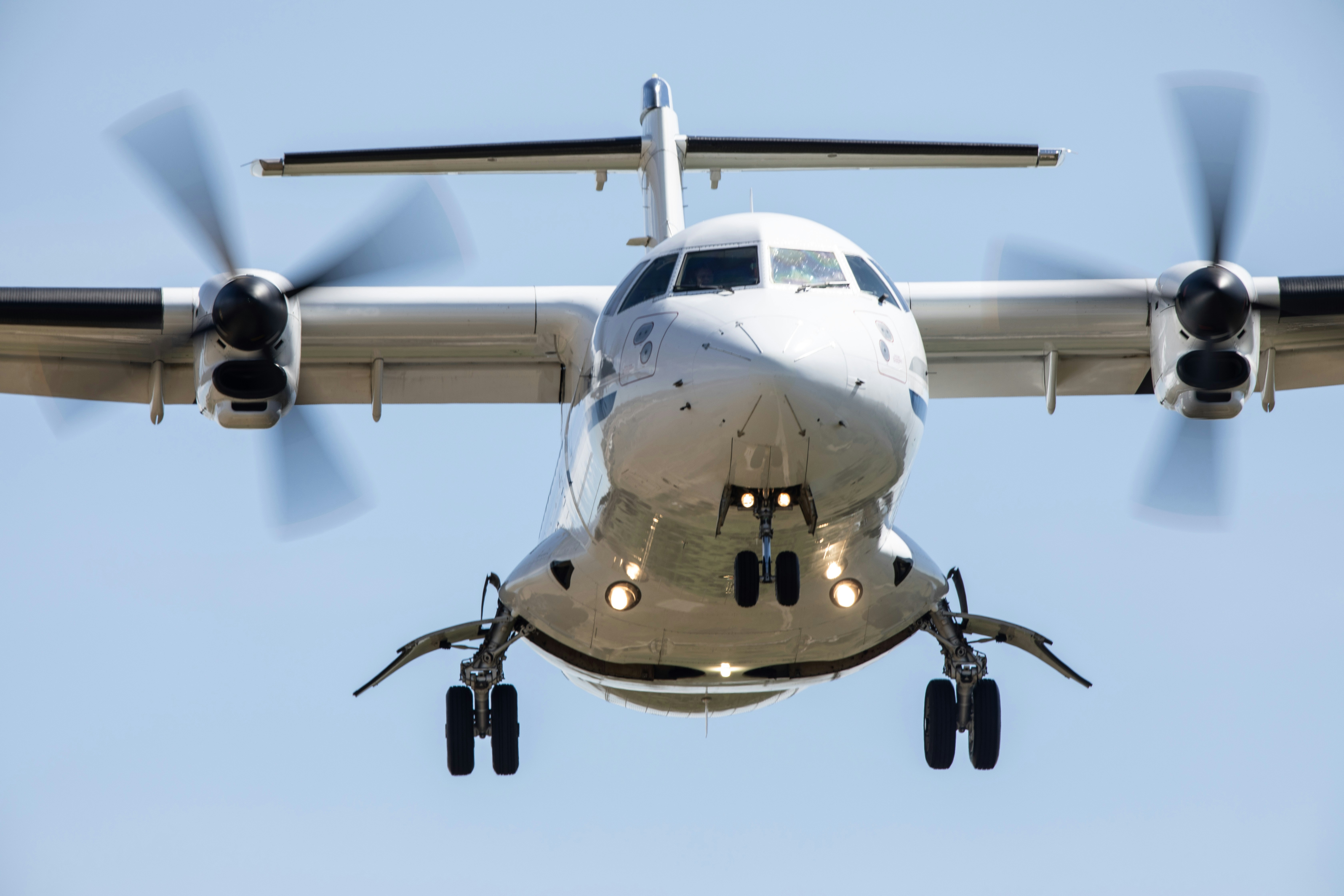 White and brown airplane under blue sky during daytime photo – Free ...