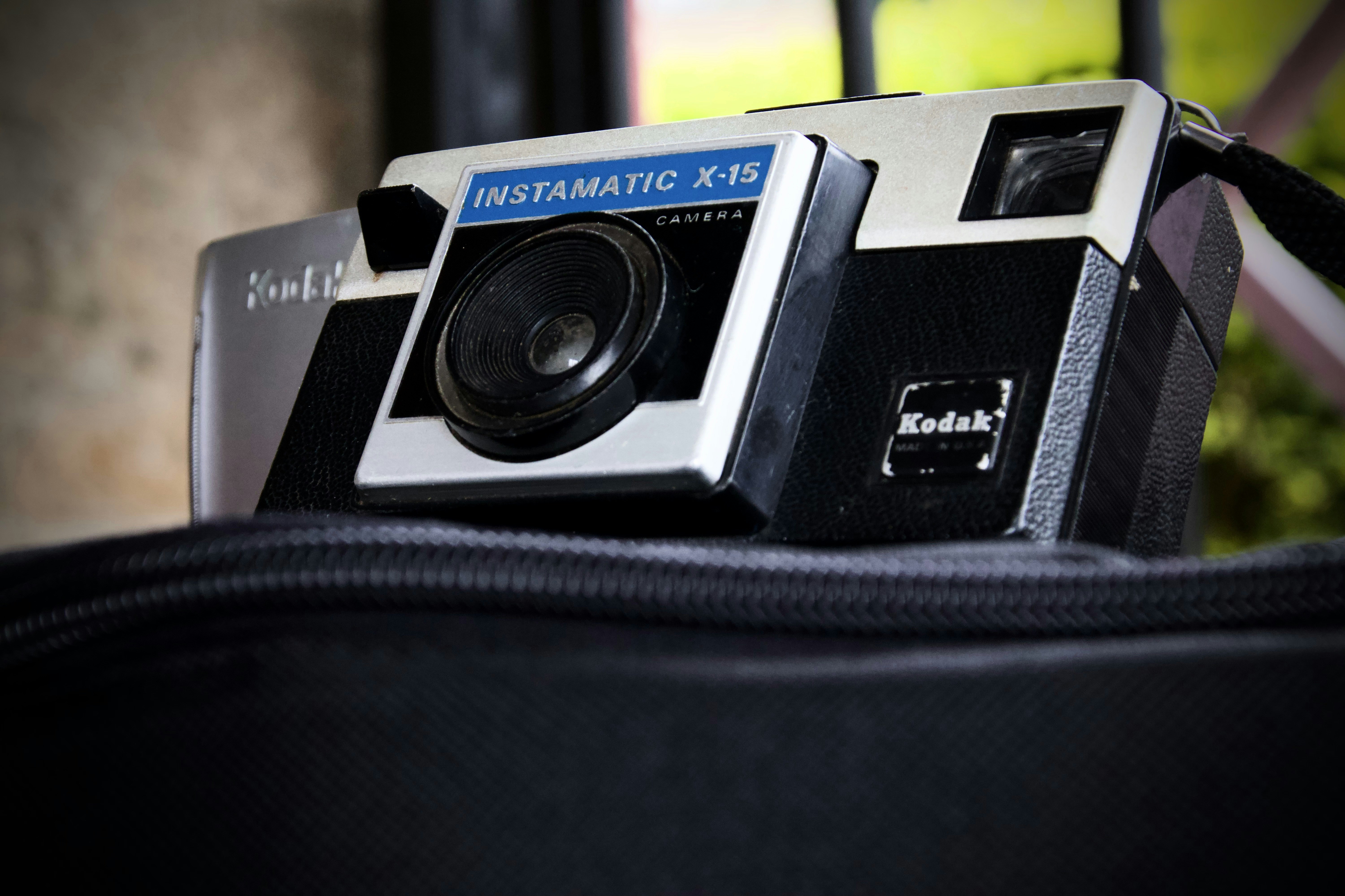 Black and white camera on black leather case photo – Free Electronics ...