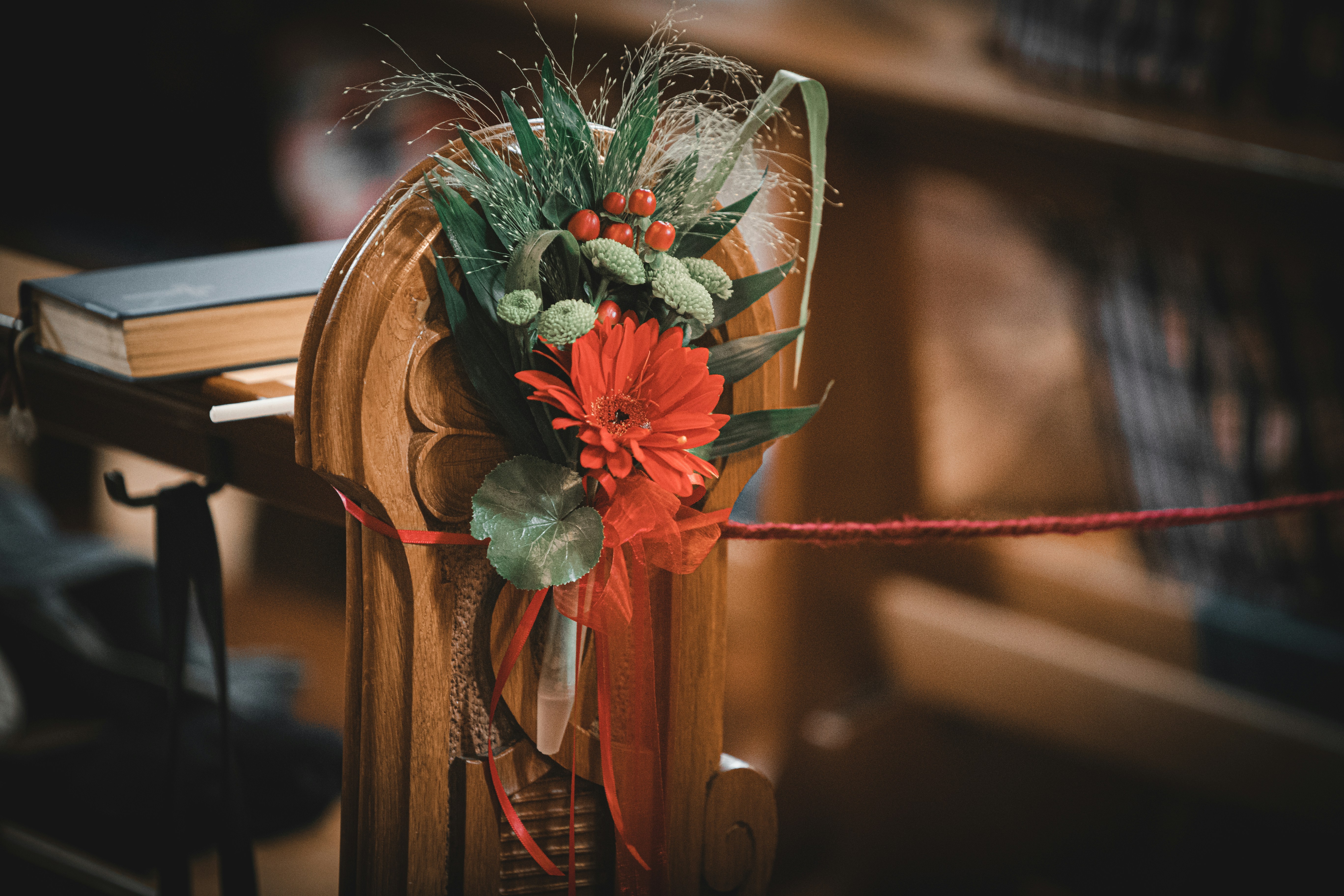 Floral Crest on a Wooden Chair Back in a Quiet Reading Nook