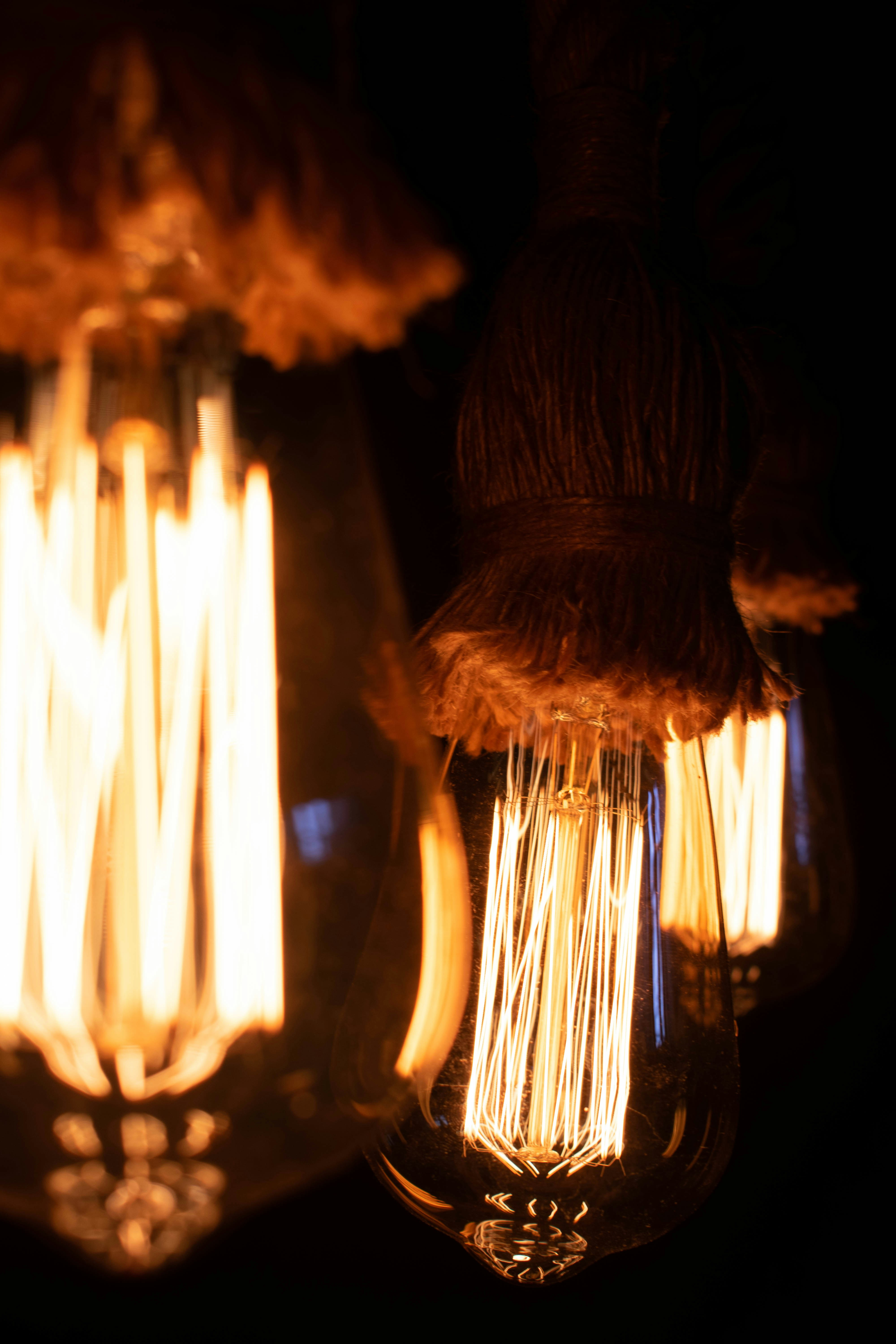 Warm Glimmer: An Intimate Close-Up of Vintage Filament Lightbulbs