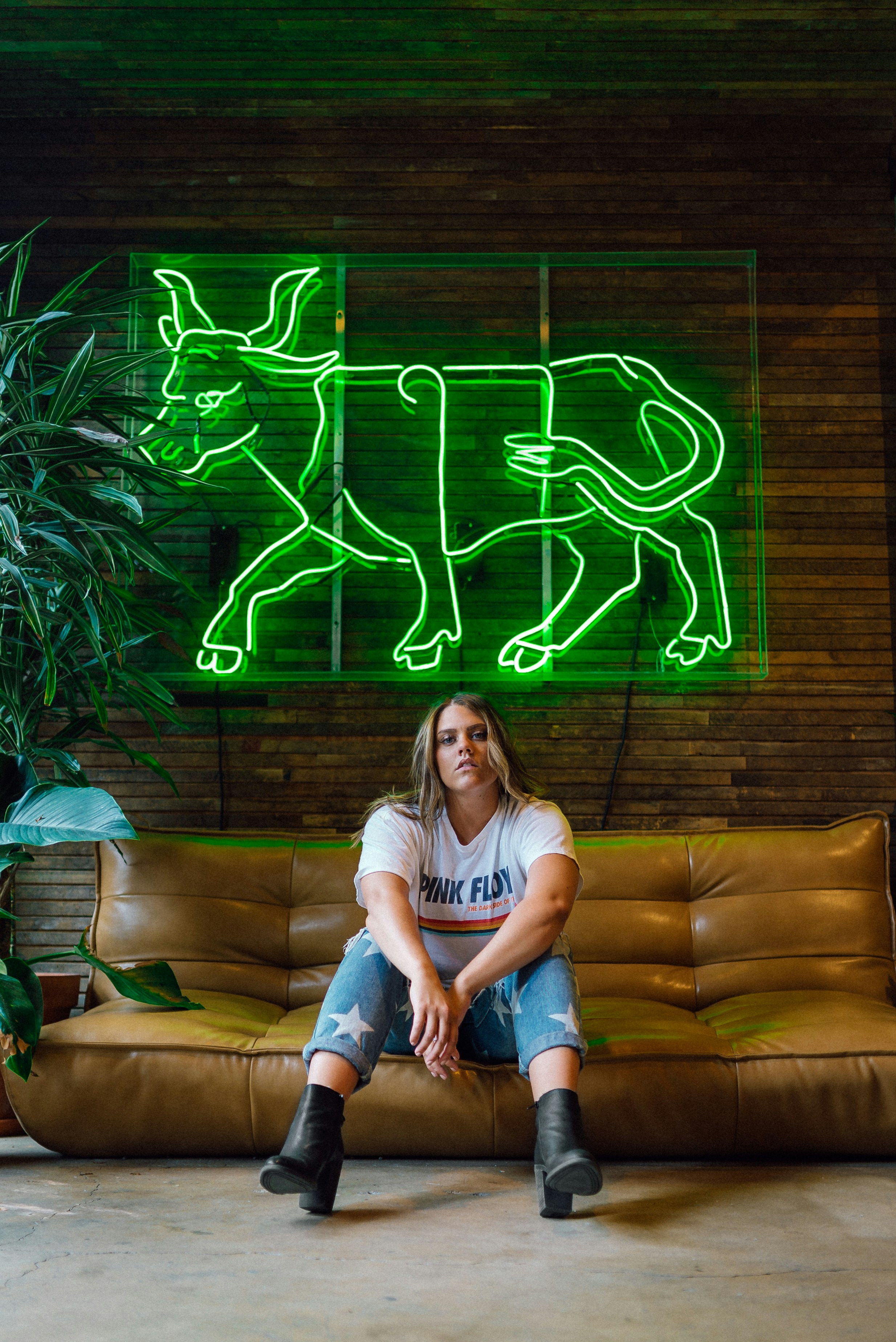 Neon Bull and City-Sleep: A Self-Commanded Moment on the Leather Couch