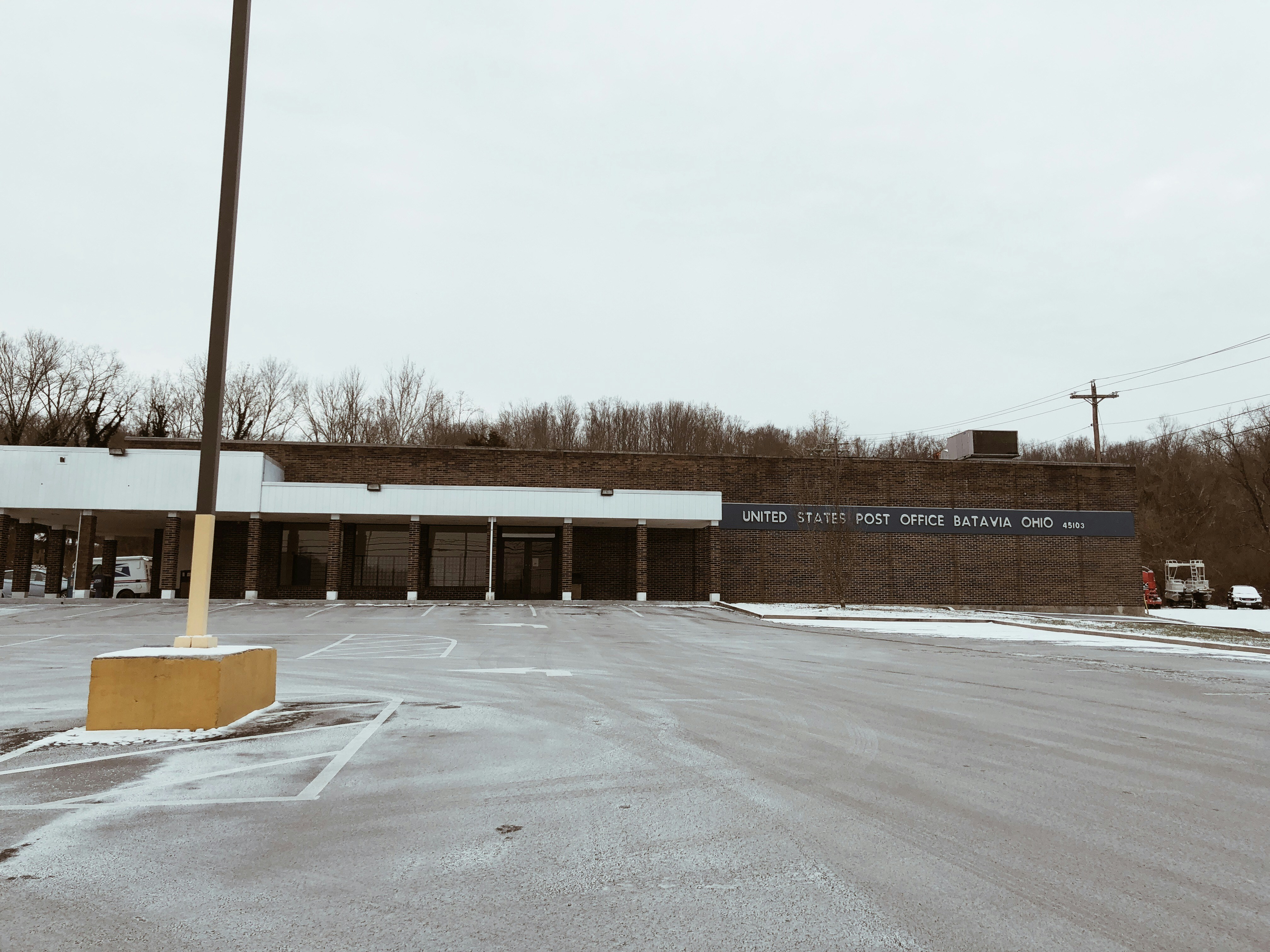 Gray concrete road near brown building during daytime photo – Free ...