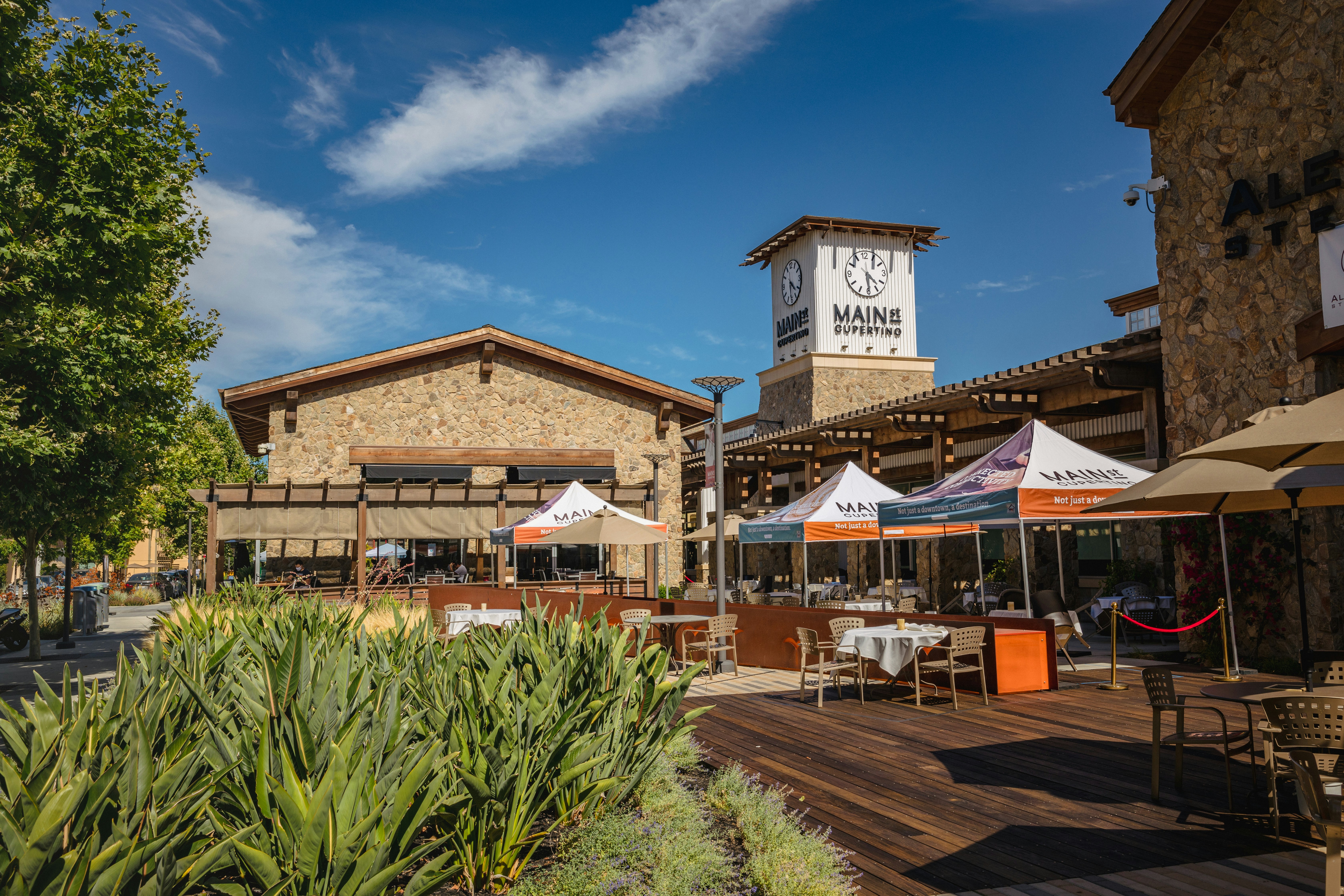 Clock Tower Terrace: Sunlit Stone Café Scene