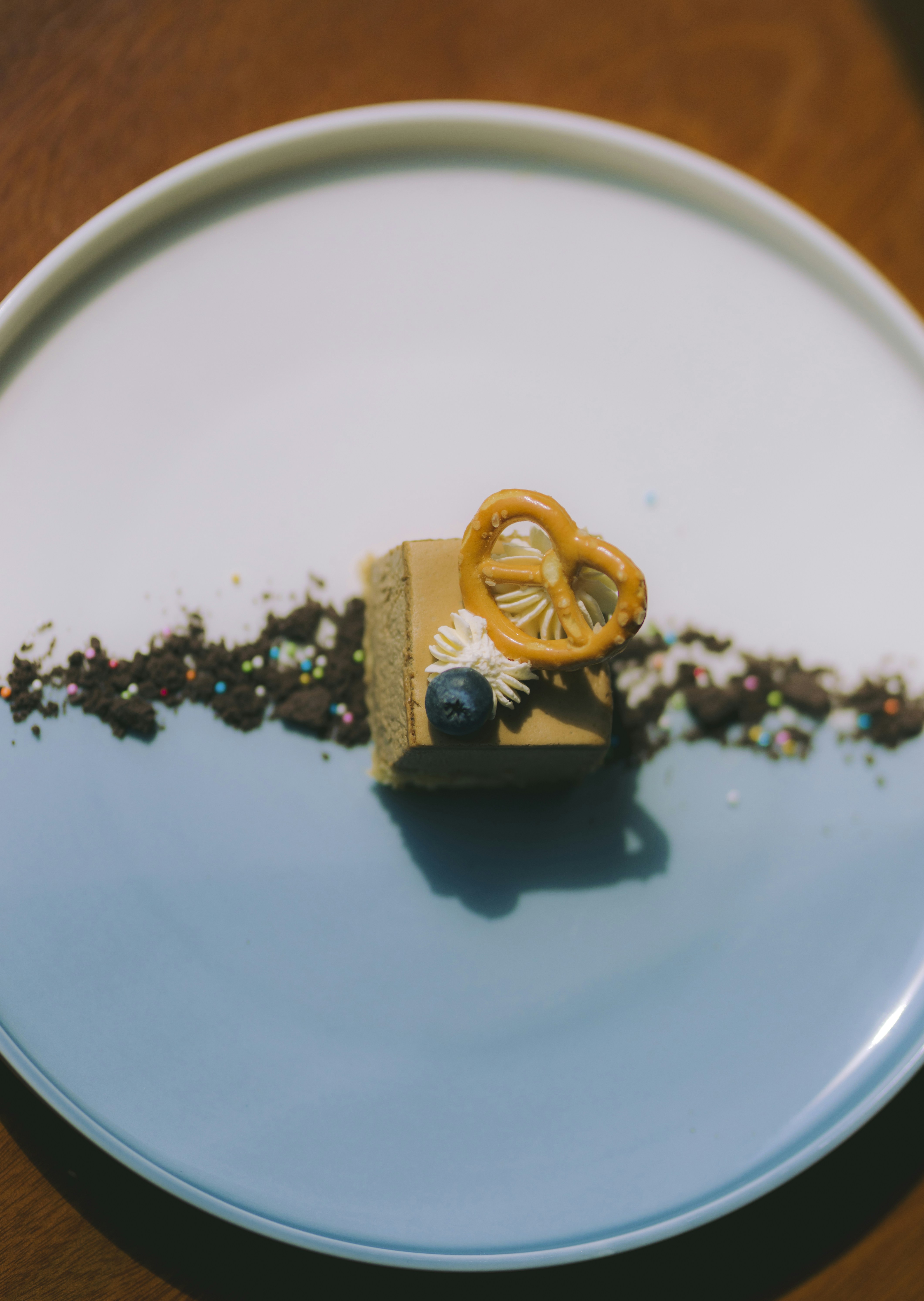 Miniature Dessert on a Splitting Plate: A Surreal Bite of Color and Texture