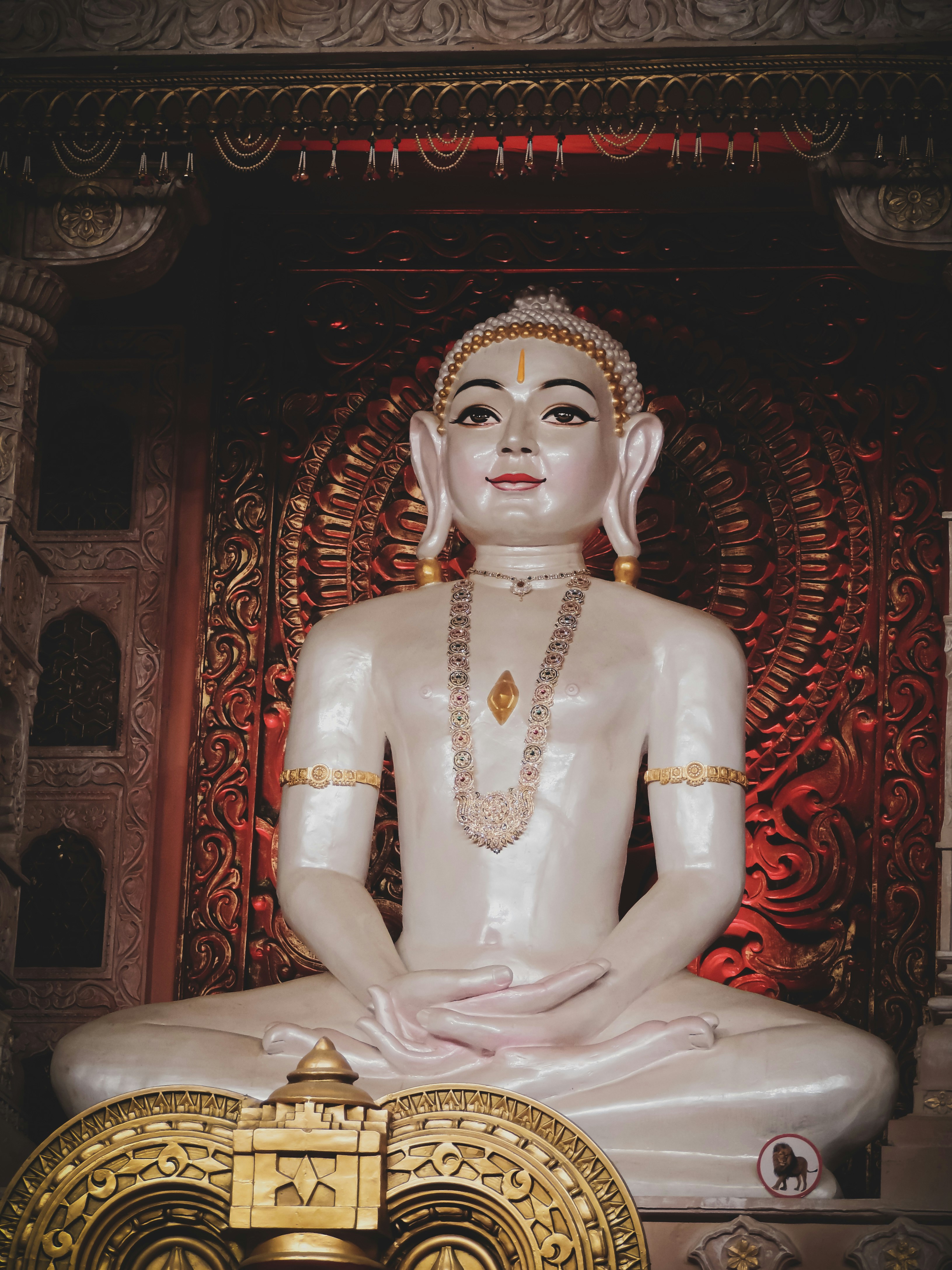 A statue of a person sitting in a meditation position photo – Free ...