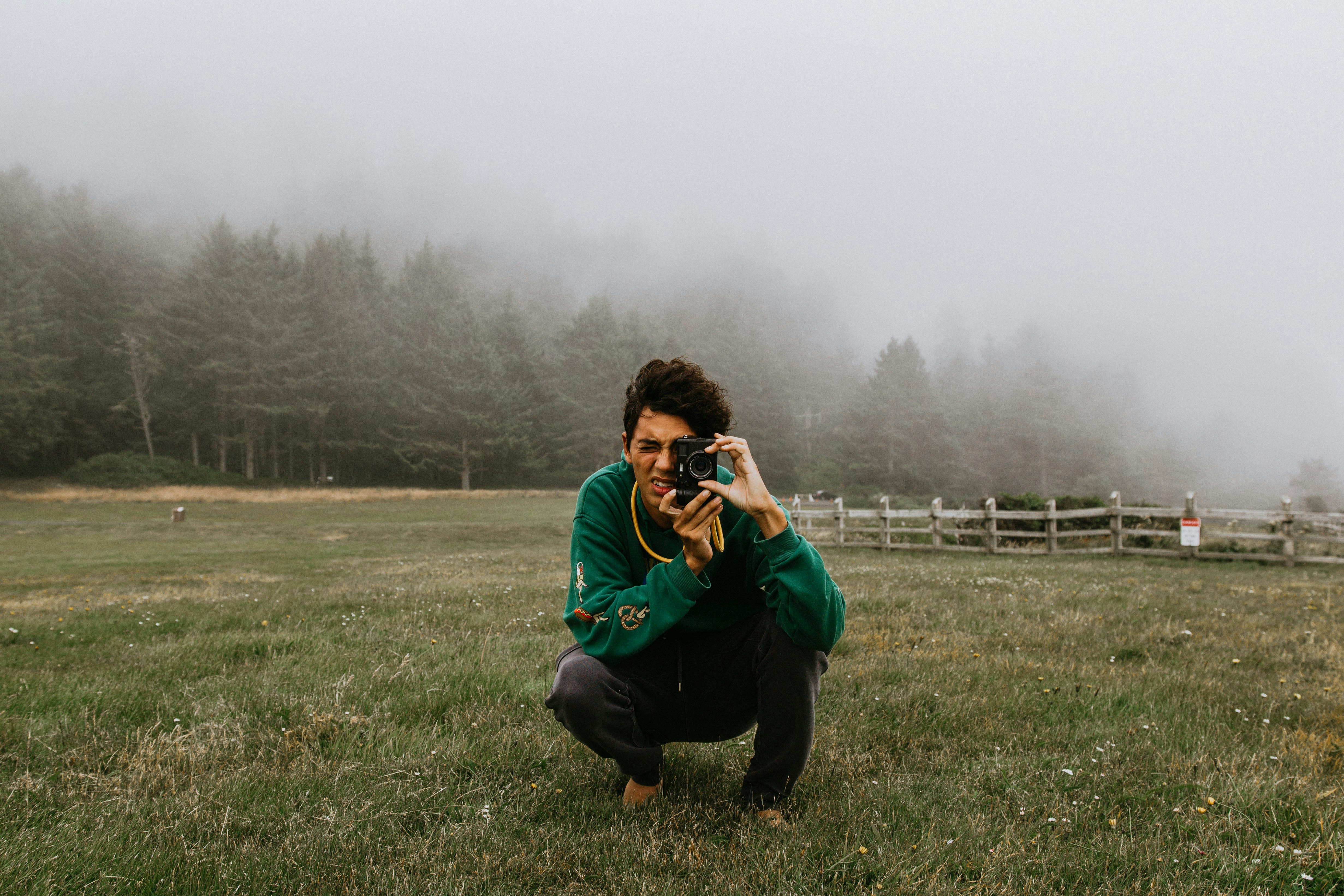 The Grassland Photographer: A Quiet Portrait in Fog