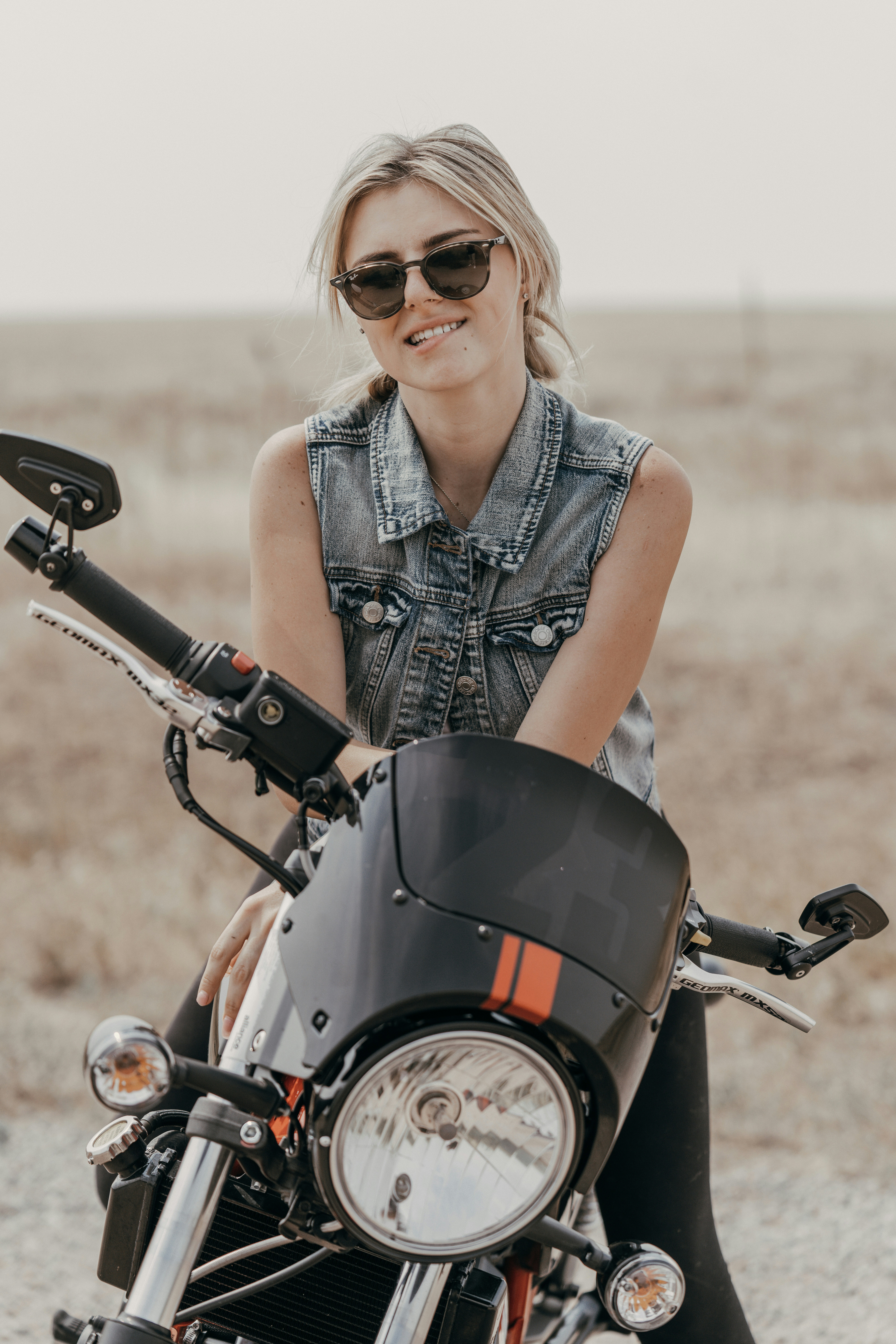 Denim and Chrome on the Open Plain: Portrait with a Retro Motorcycle