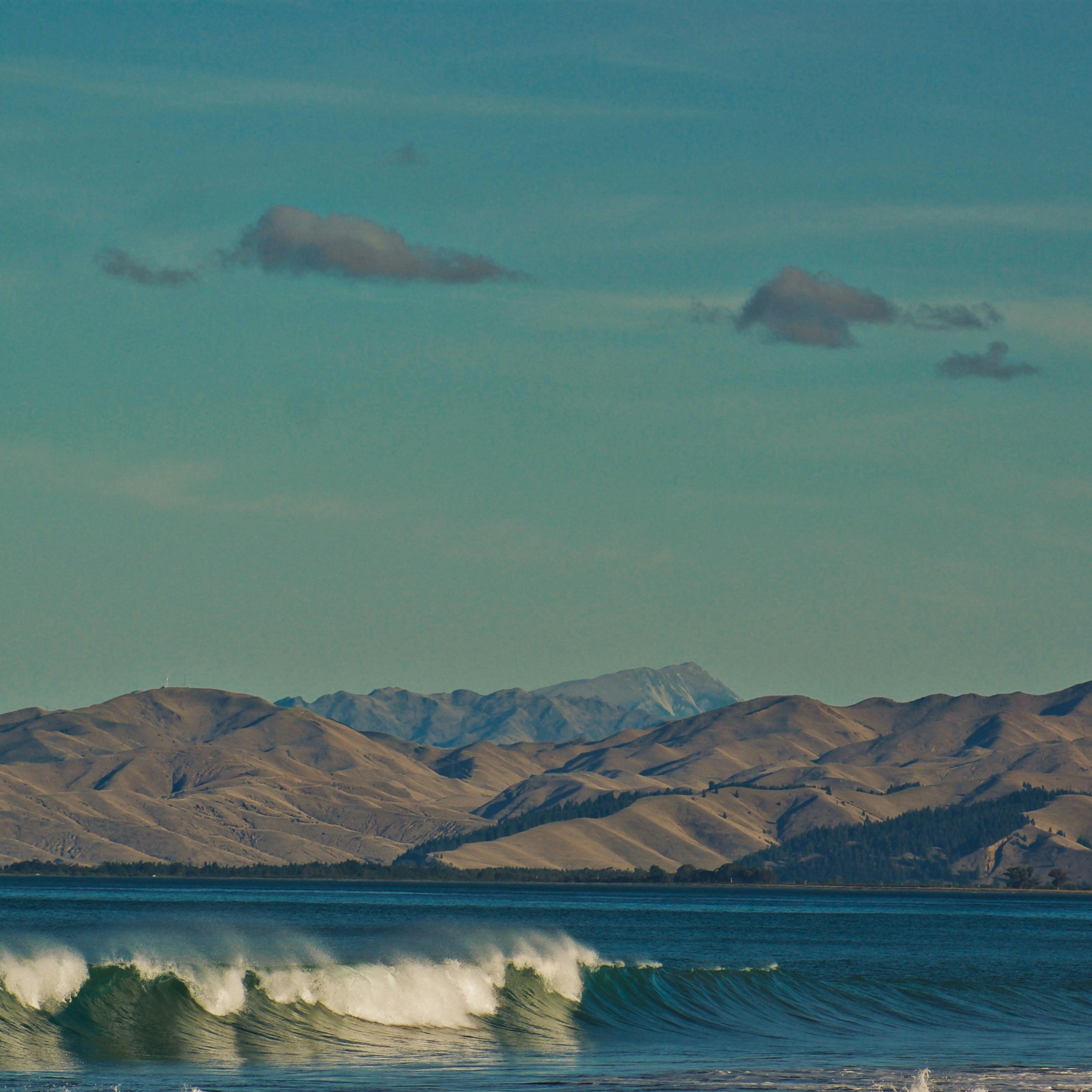 Brown mountains near body of water during daytime photo – Free Grey ...