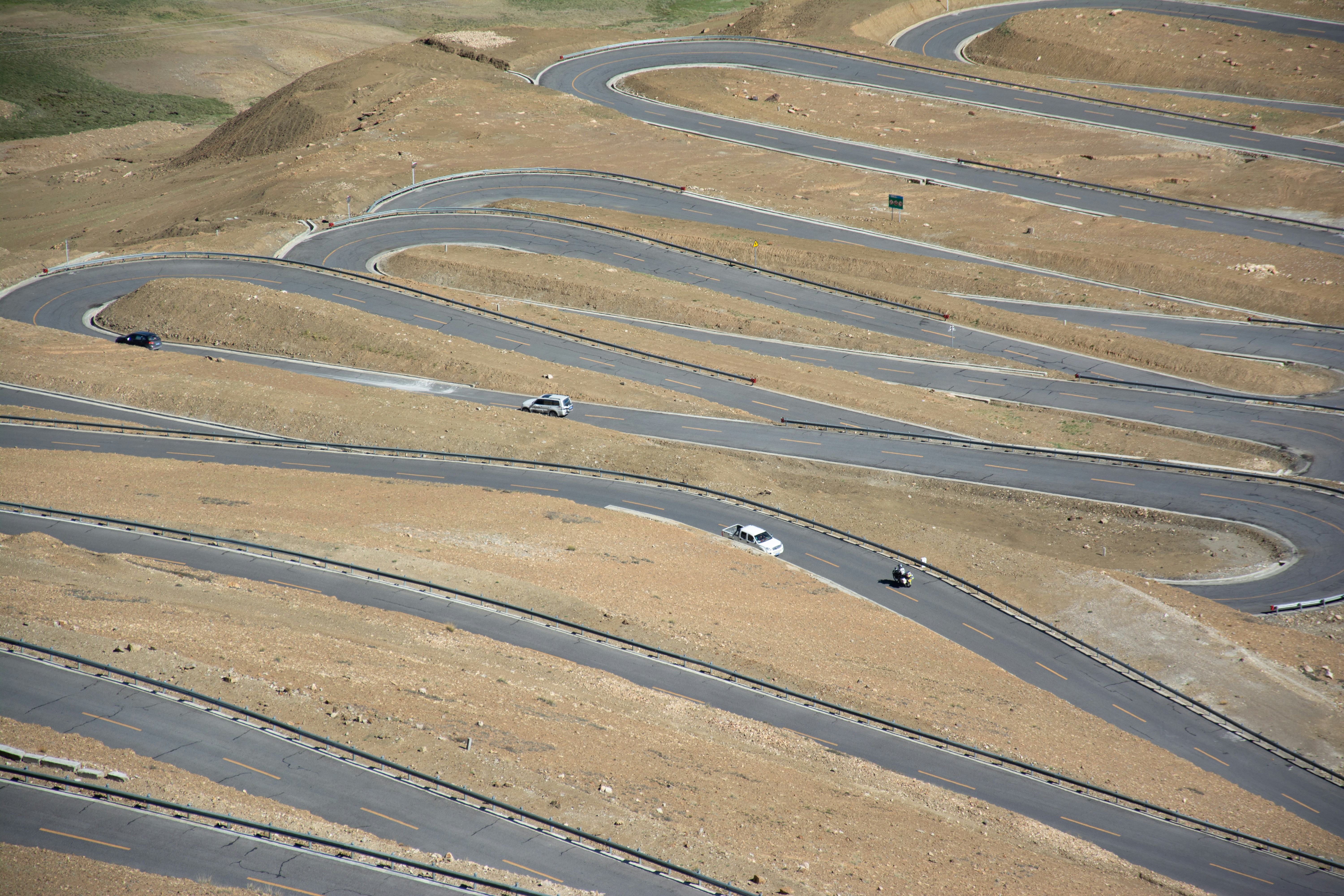 Desert Serpentine: Cars Navigate a Ribbon of Hairpins