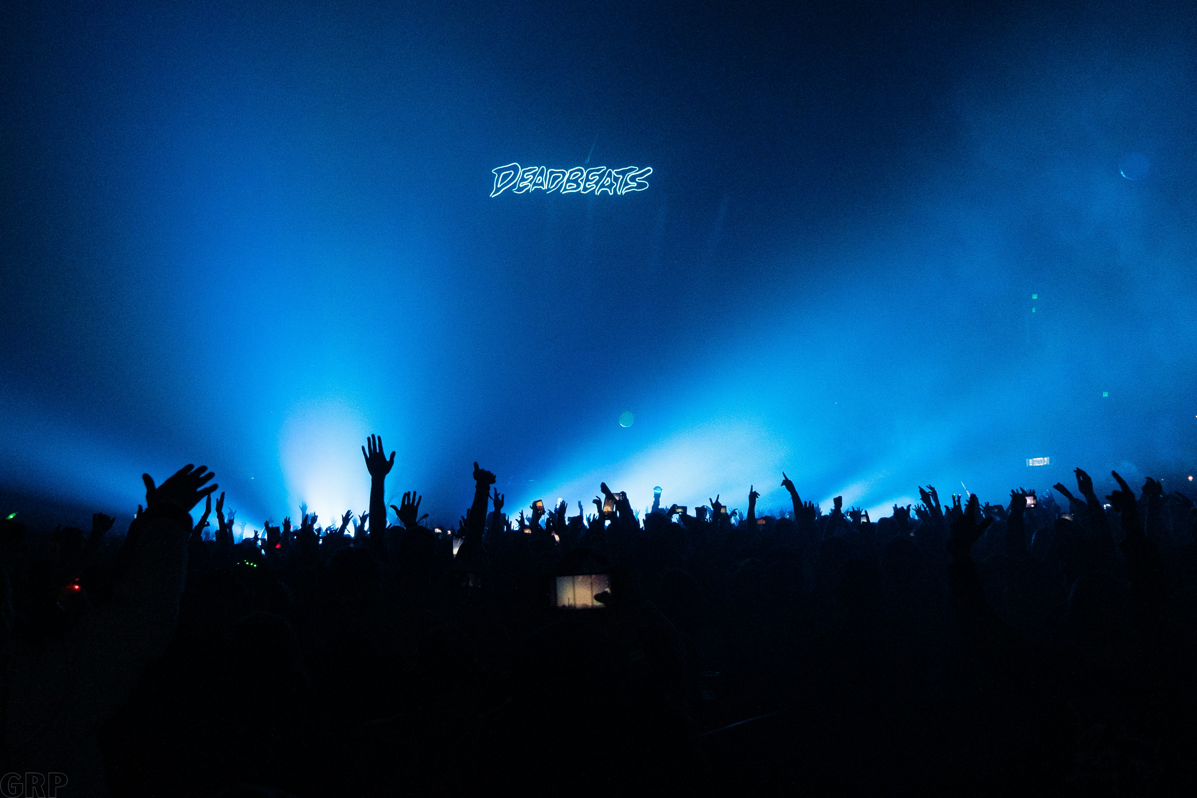 Central Glow: Hands Reaching Toward the Neon Pulse