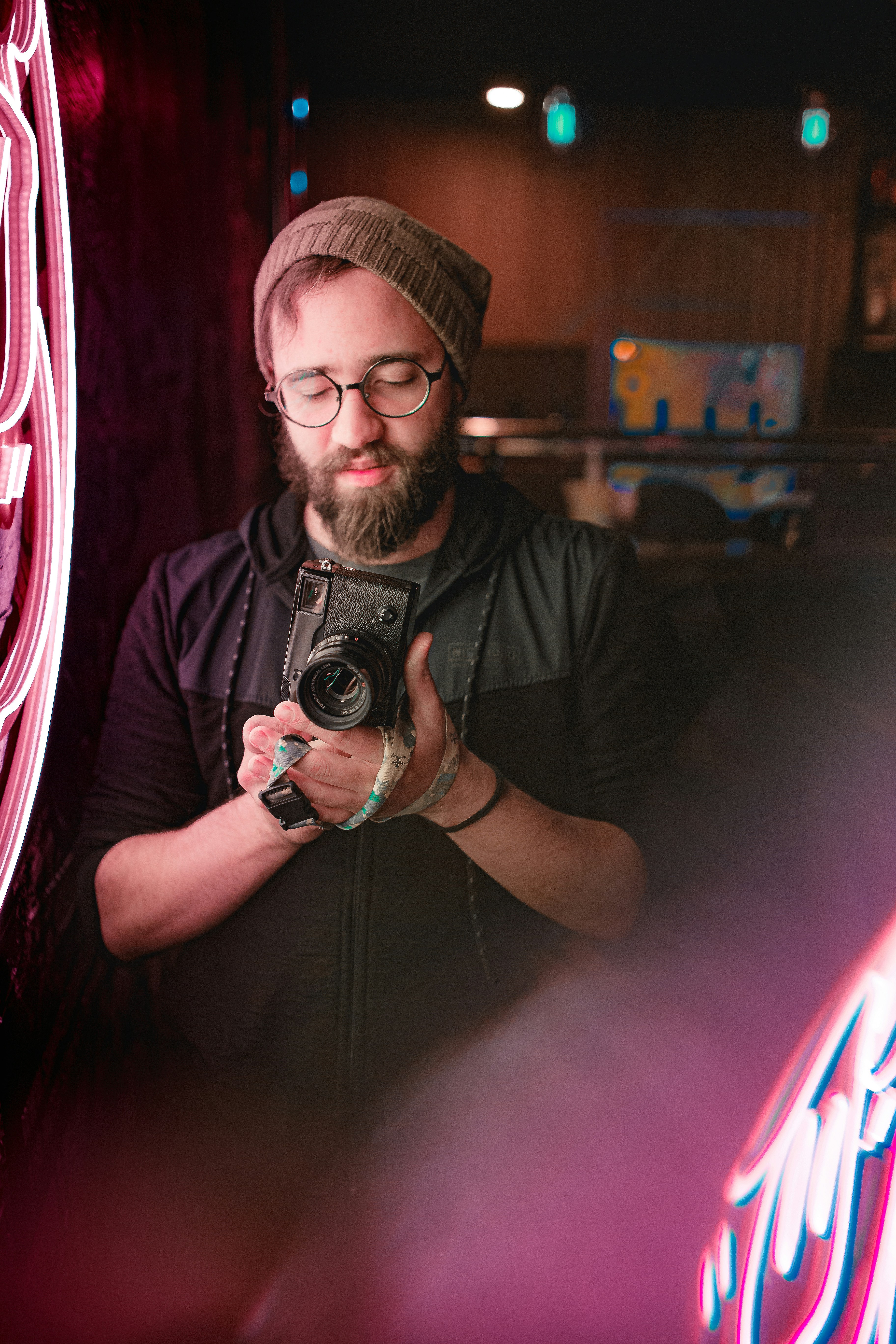 Neon Portrait: The Cameraman in a Glowing Alley