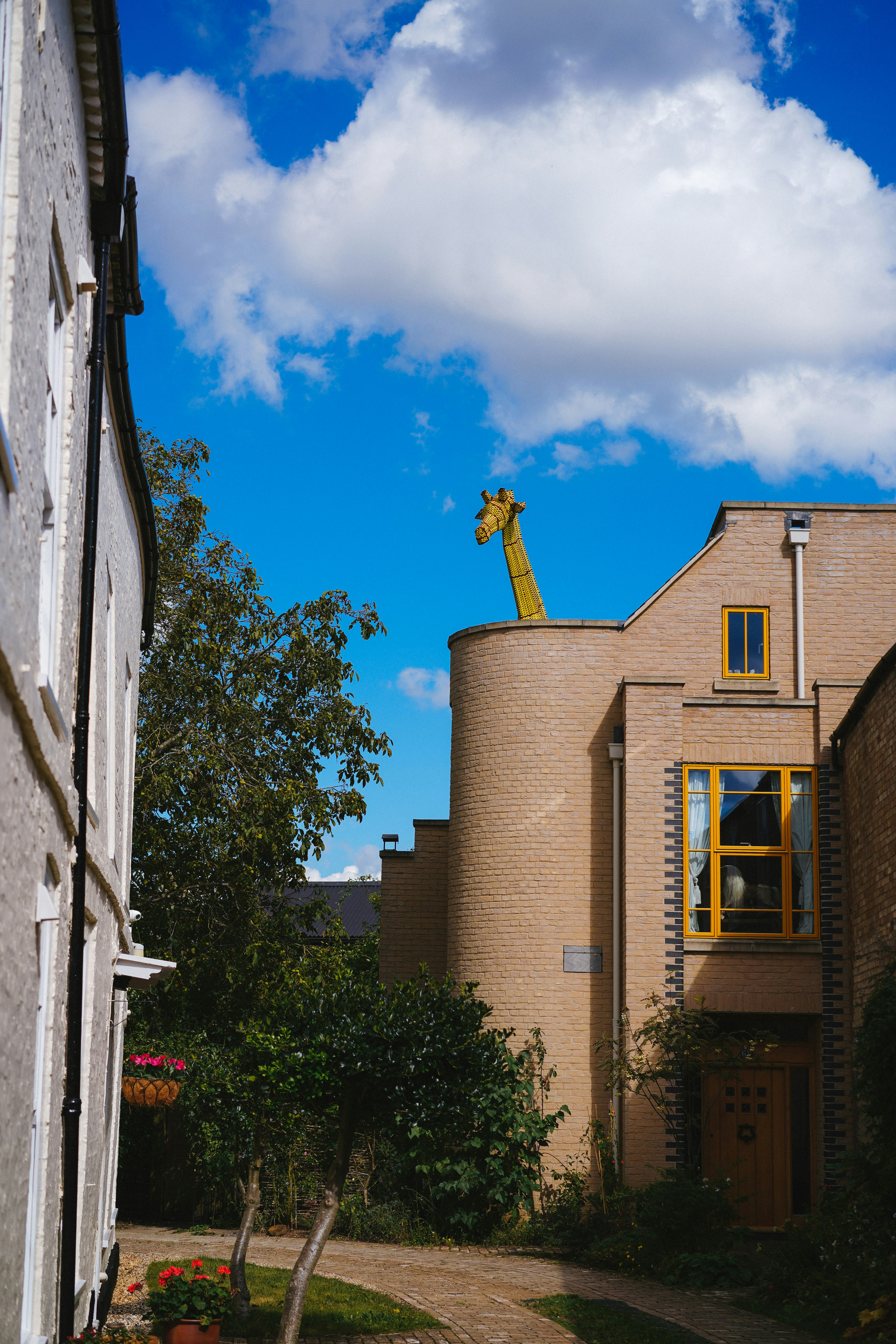 Yellow Dragon Topiary: Urban Courtyard with a Playful Crane