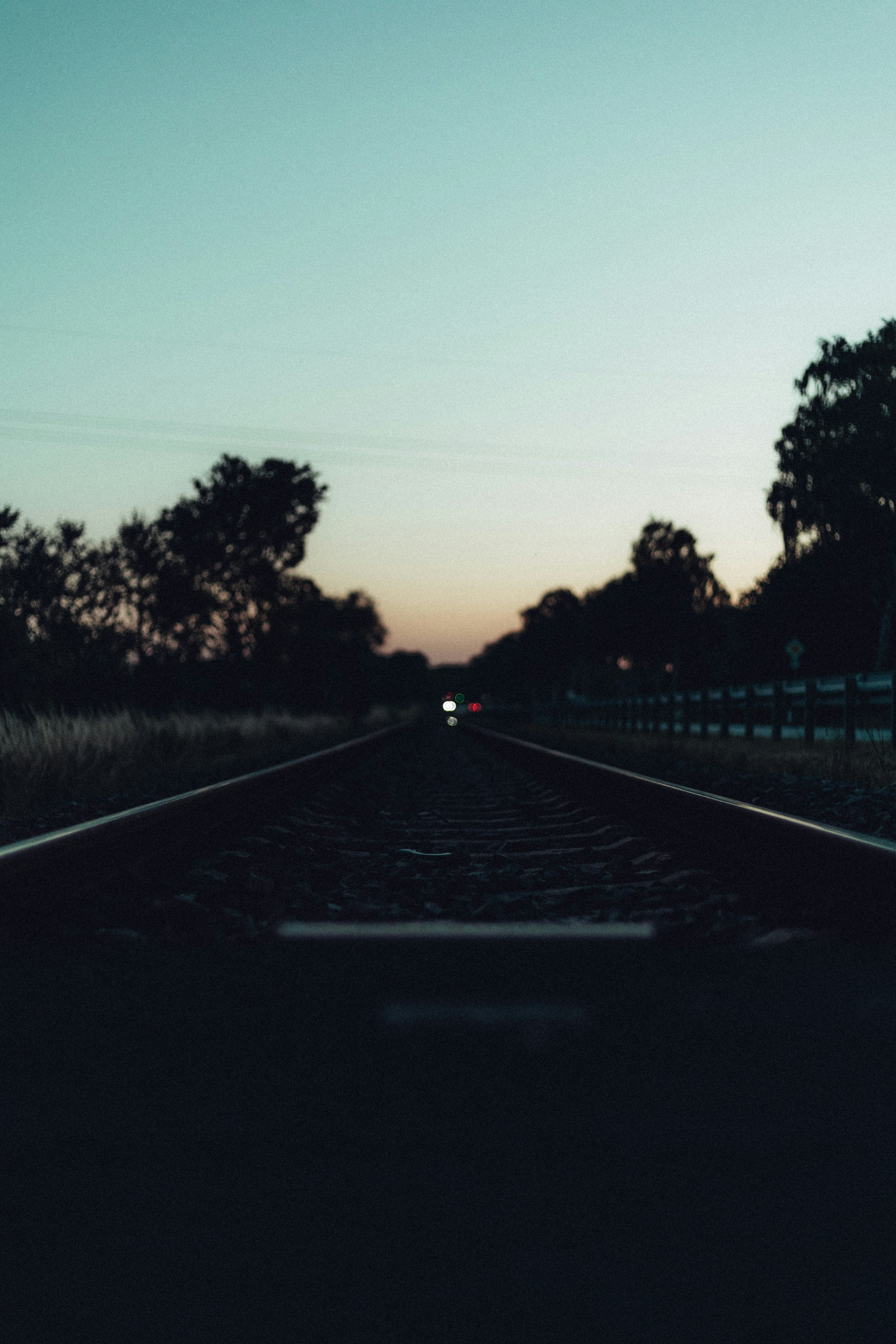 Distant Rails at Dusk: A Quiet Descent into Evening