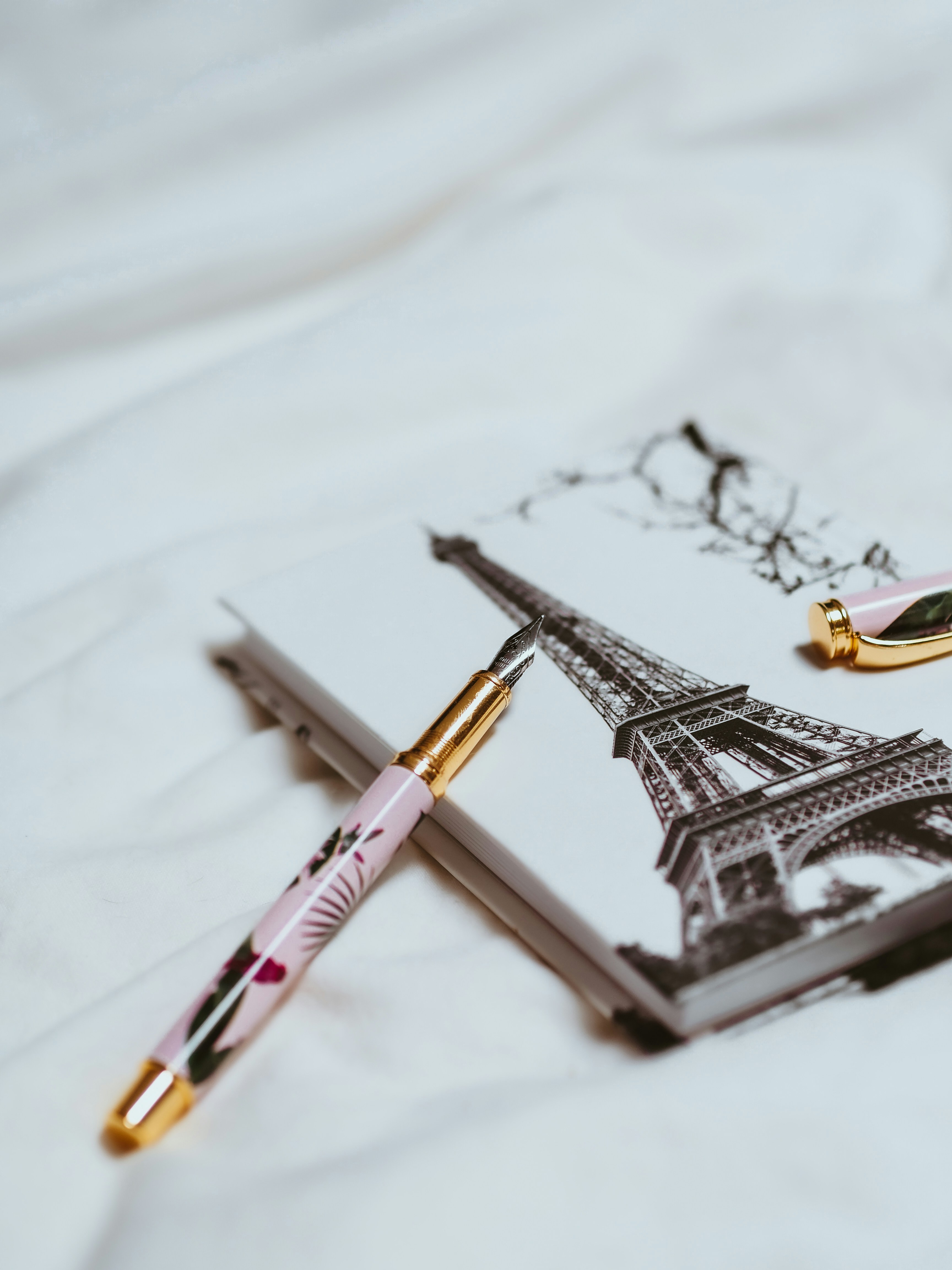 White and pink click pen on white printer paper photo – Free ...