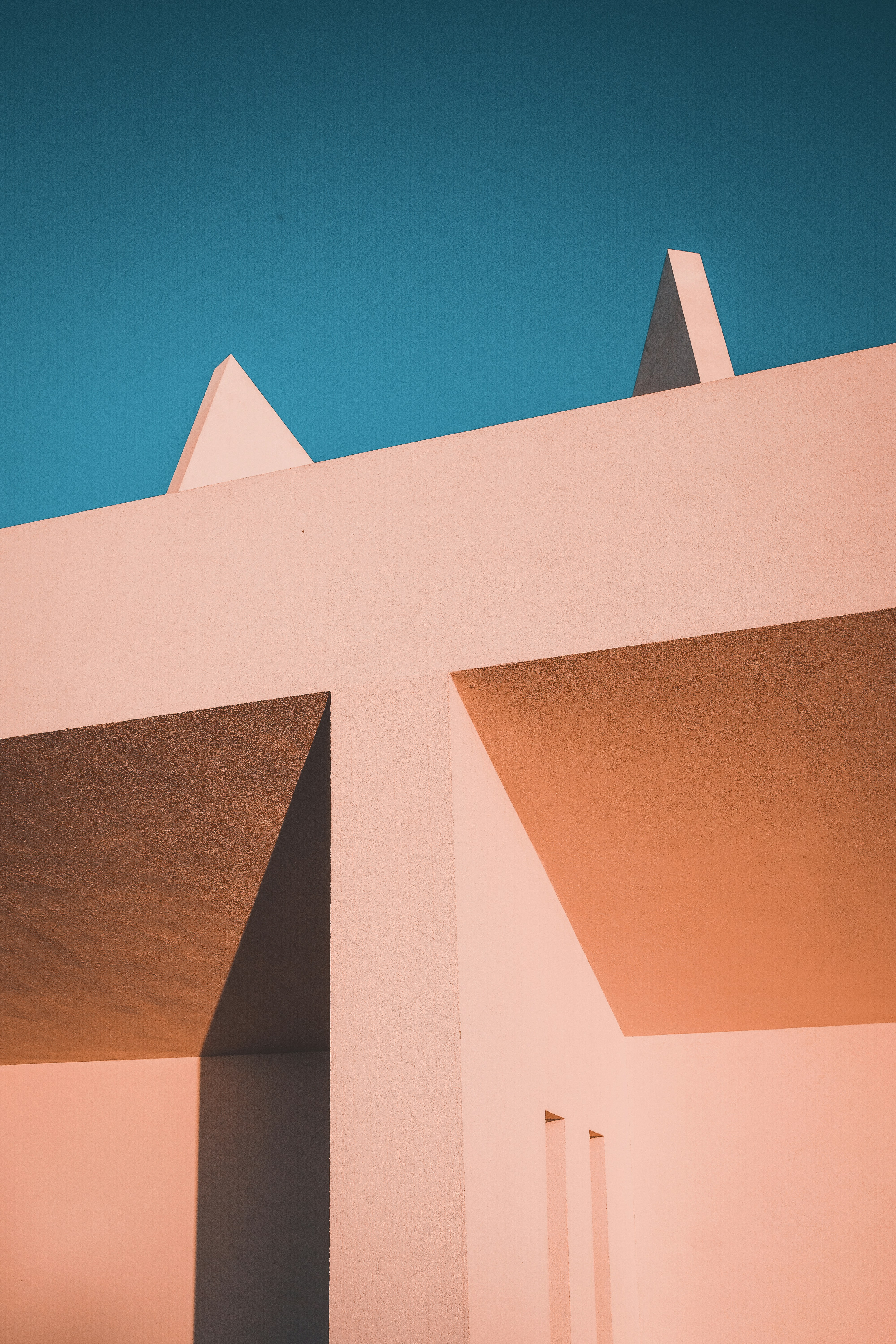 brown concrete building under blue sky during daytime