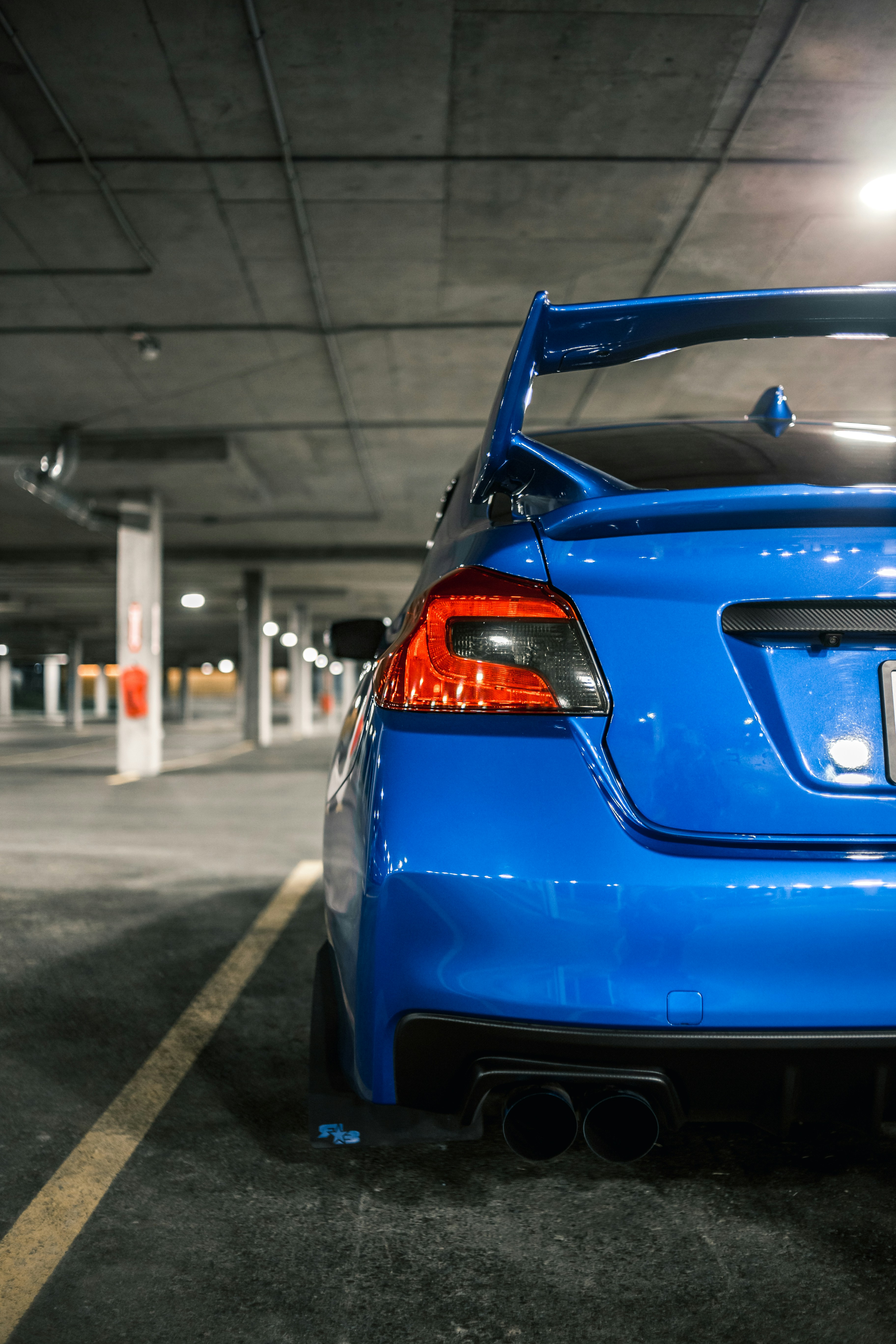 Blue car parked on parking lot photo – Free Blue Image on Unsplash