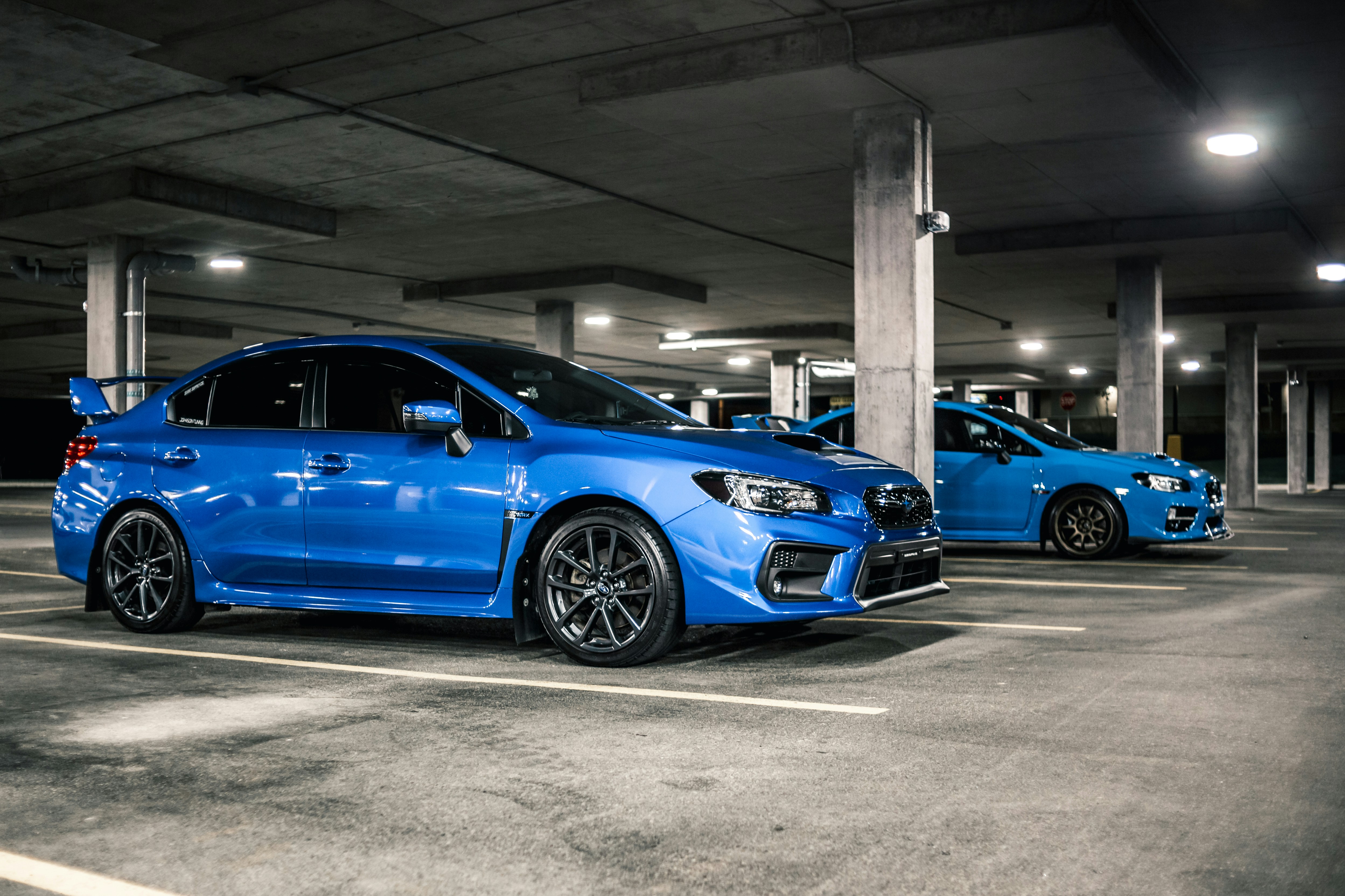 blue bmw m 3 coupe parked on parking lot