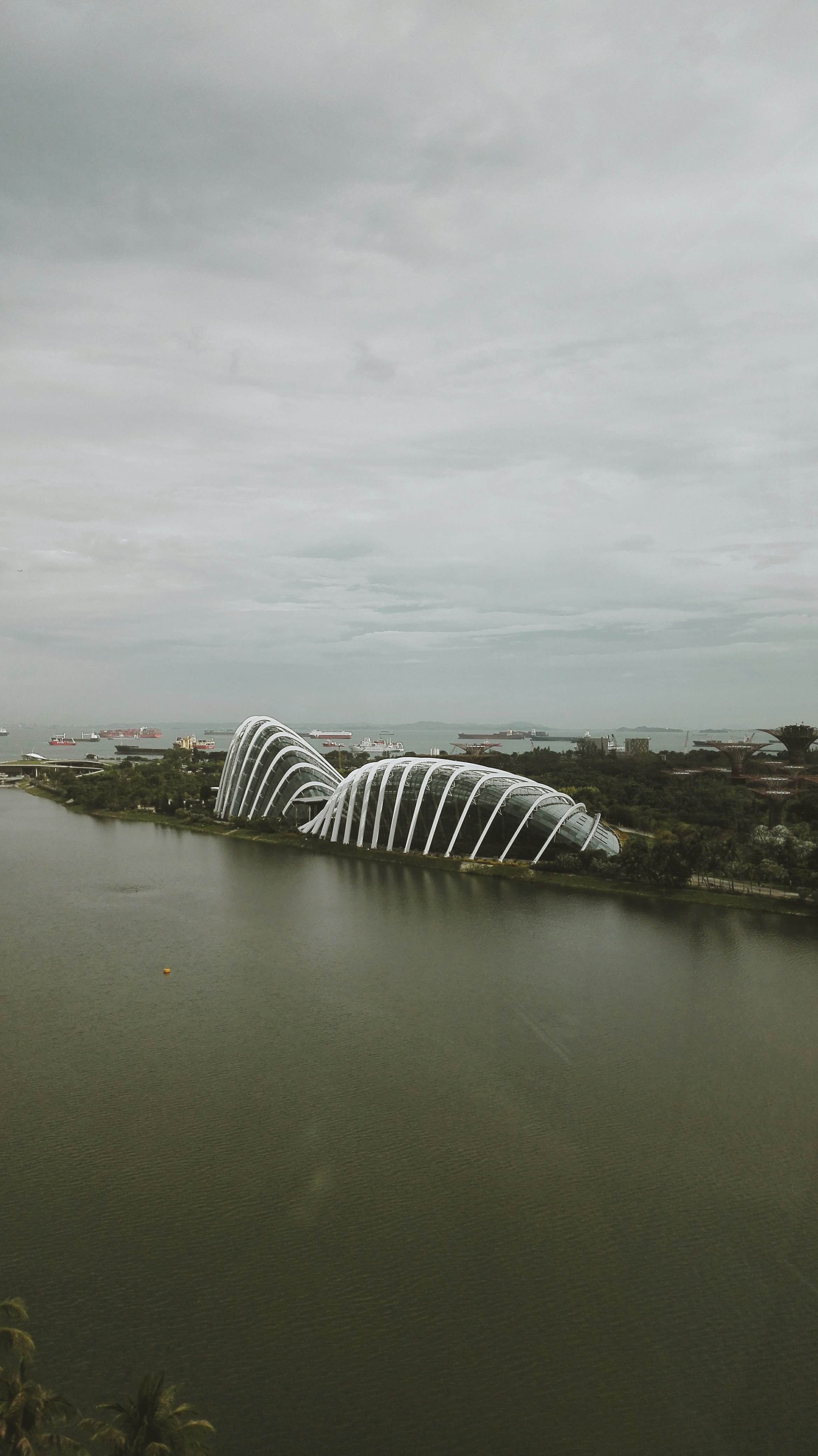 White Ribbed Glass Domes Over a Quiet River