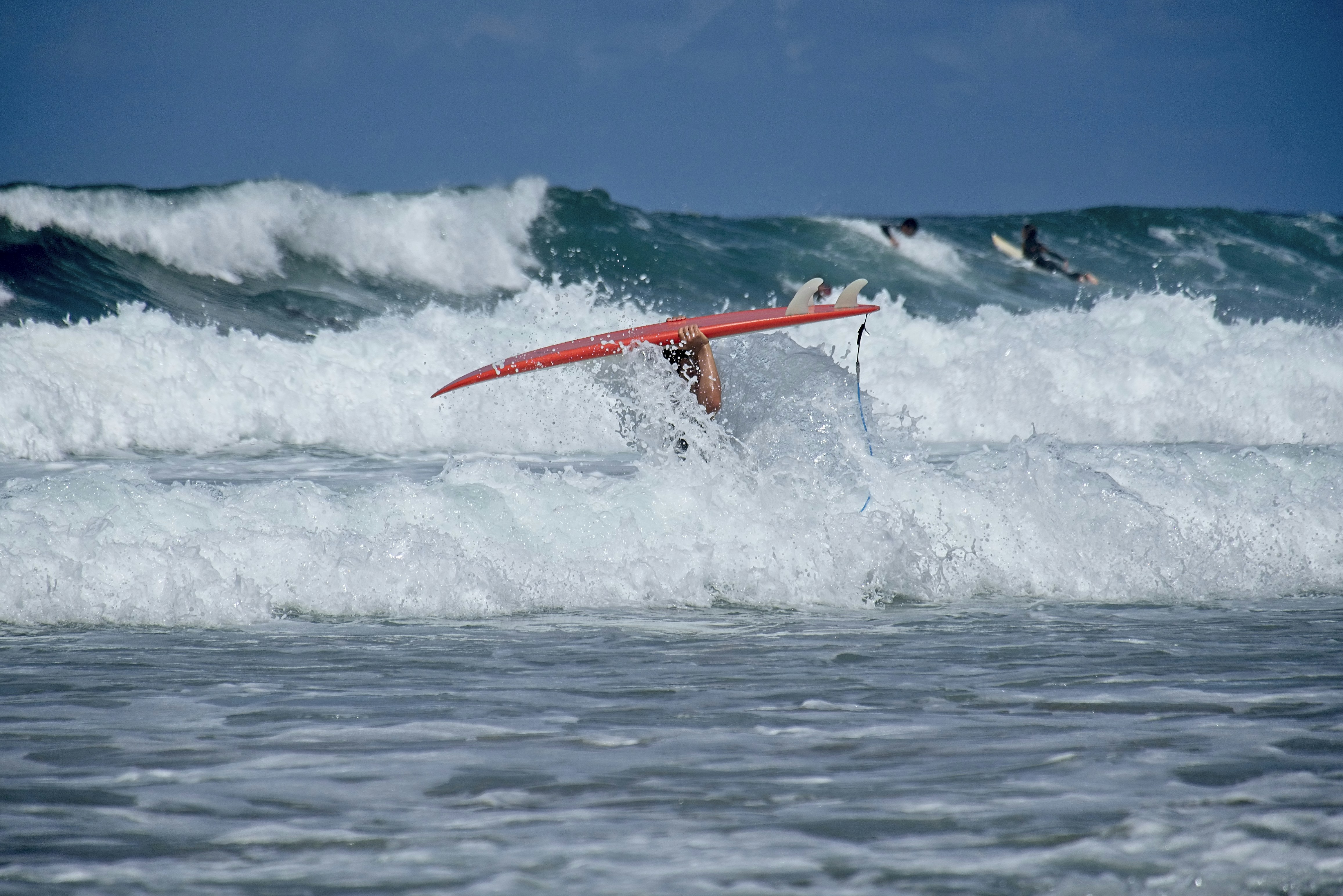 Red surfboard on sea waves during daytime photo – Free Ocean Image on ...