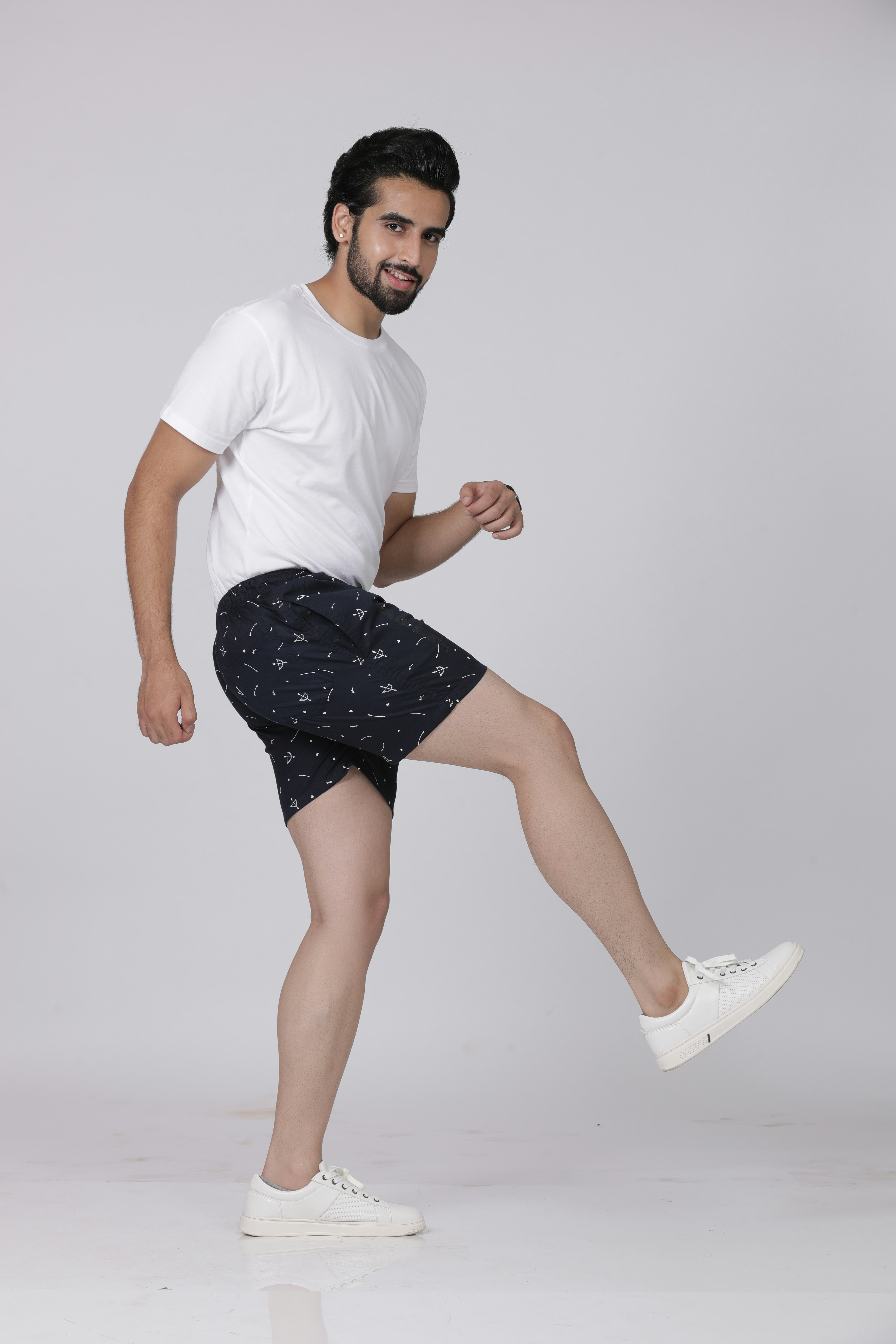 Studio Kick: Confidence in White Tee and Astral-Print Shorts