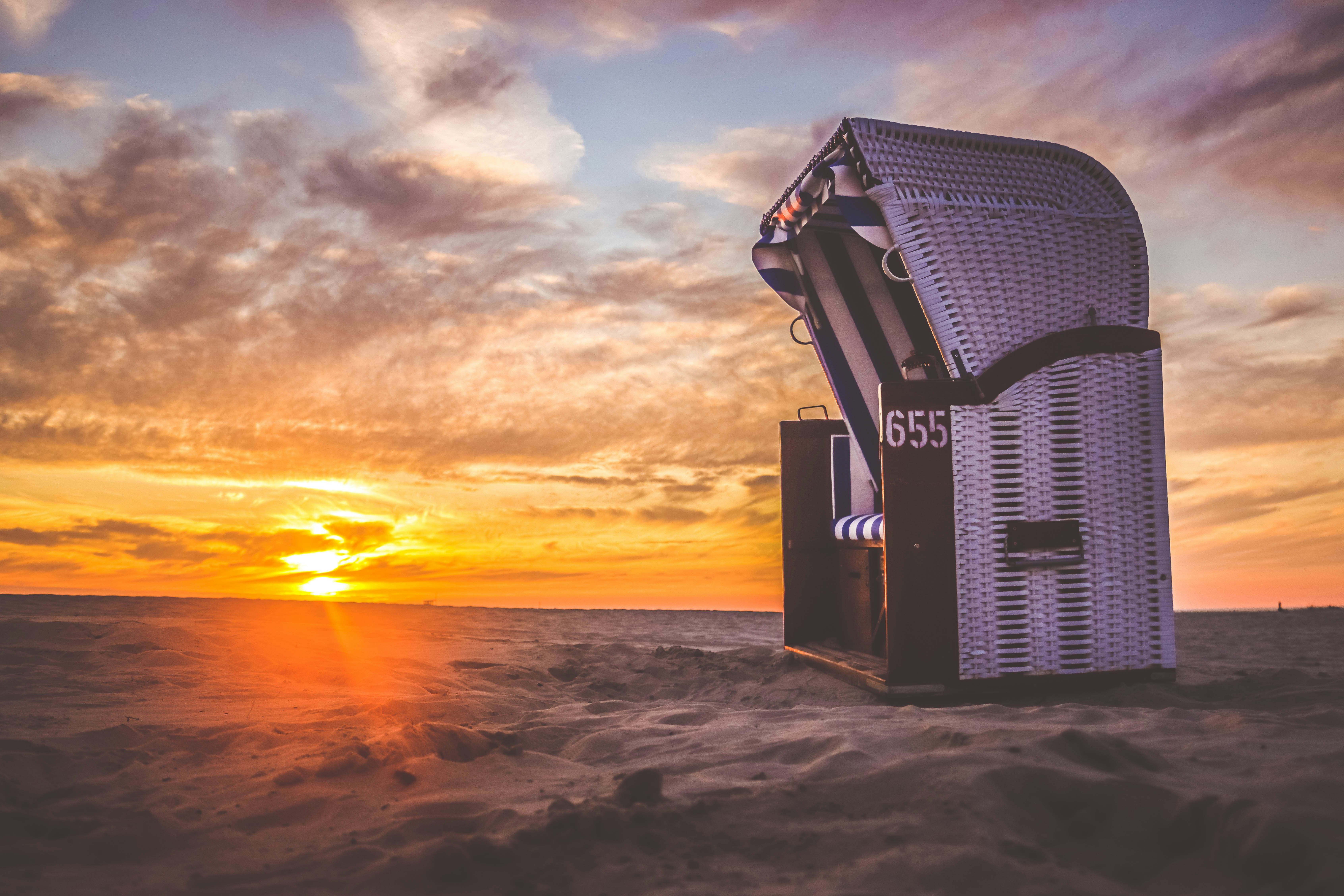 Sunset Lift: A lone beach chair on the luminous shore