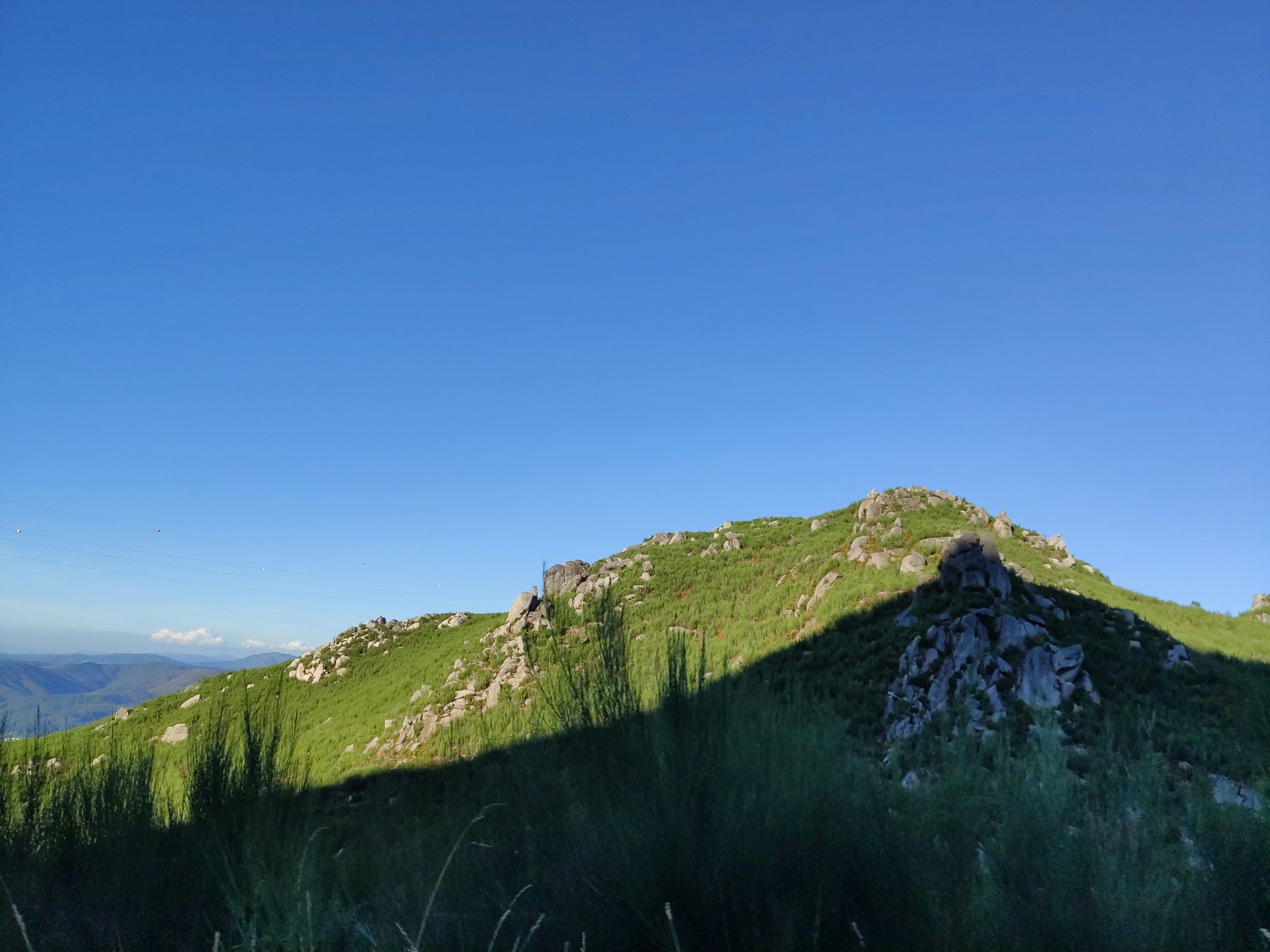 Verdant Hills Under Clear Azure